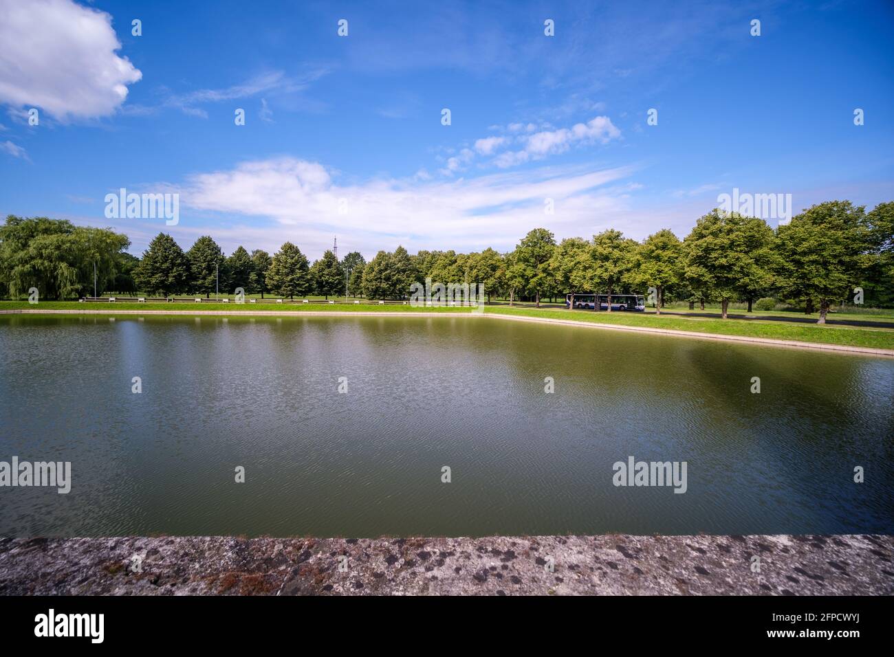 wide river landscape scene with large body of water, blue reflections ...