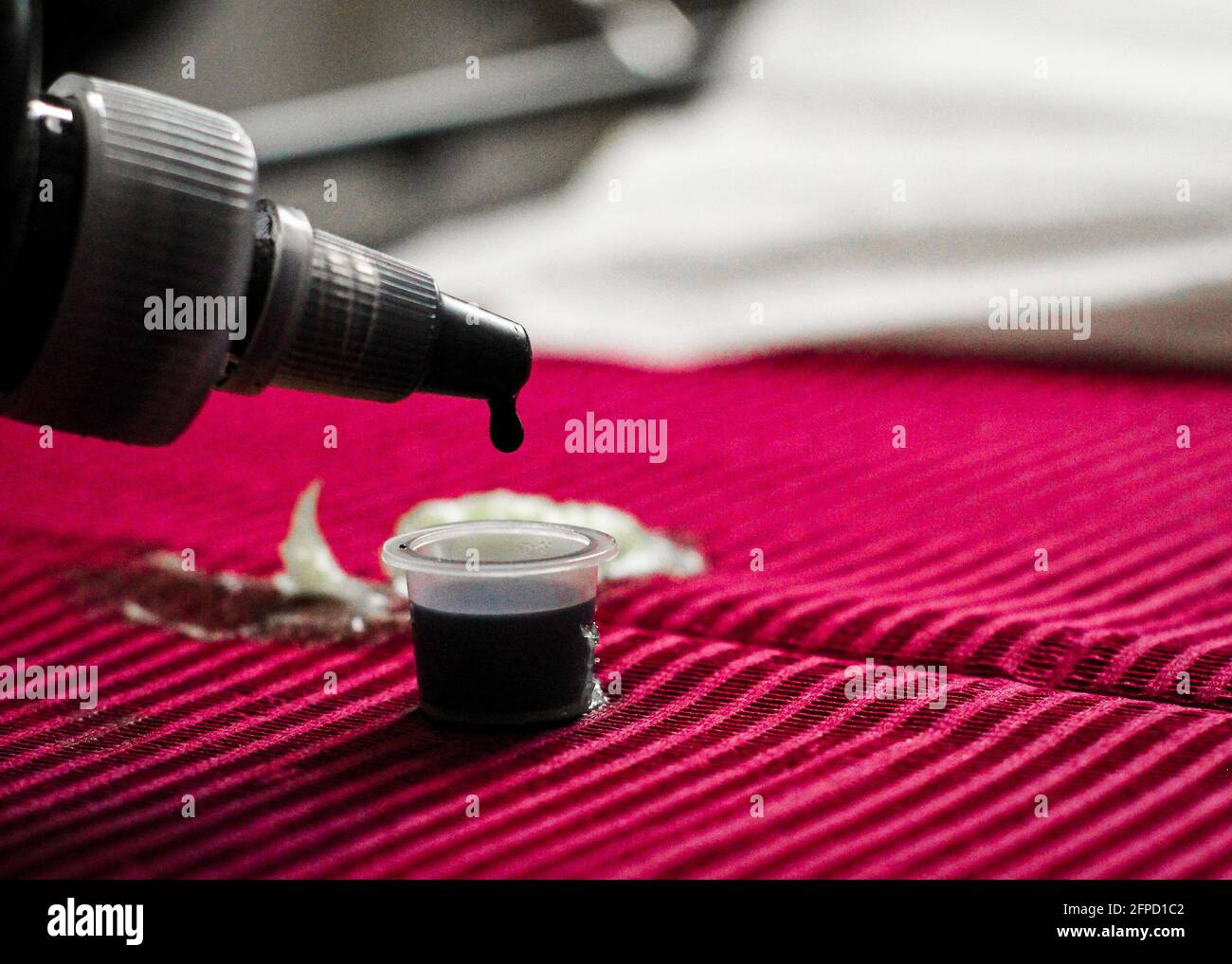 Close-up shot of tattoo ink dropping into a contain Stock Photo - Alamy