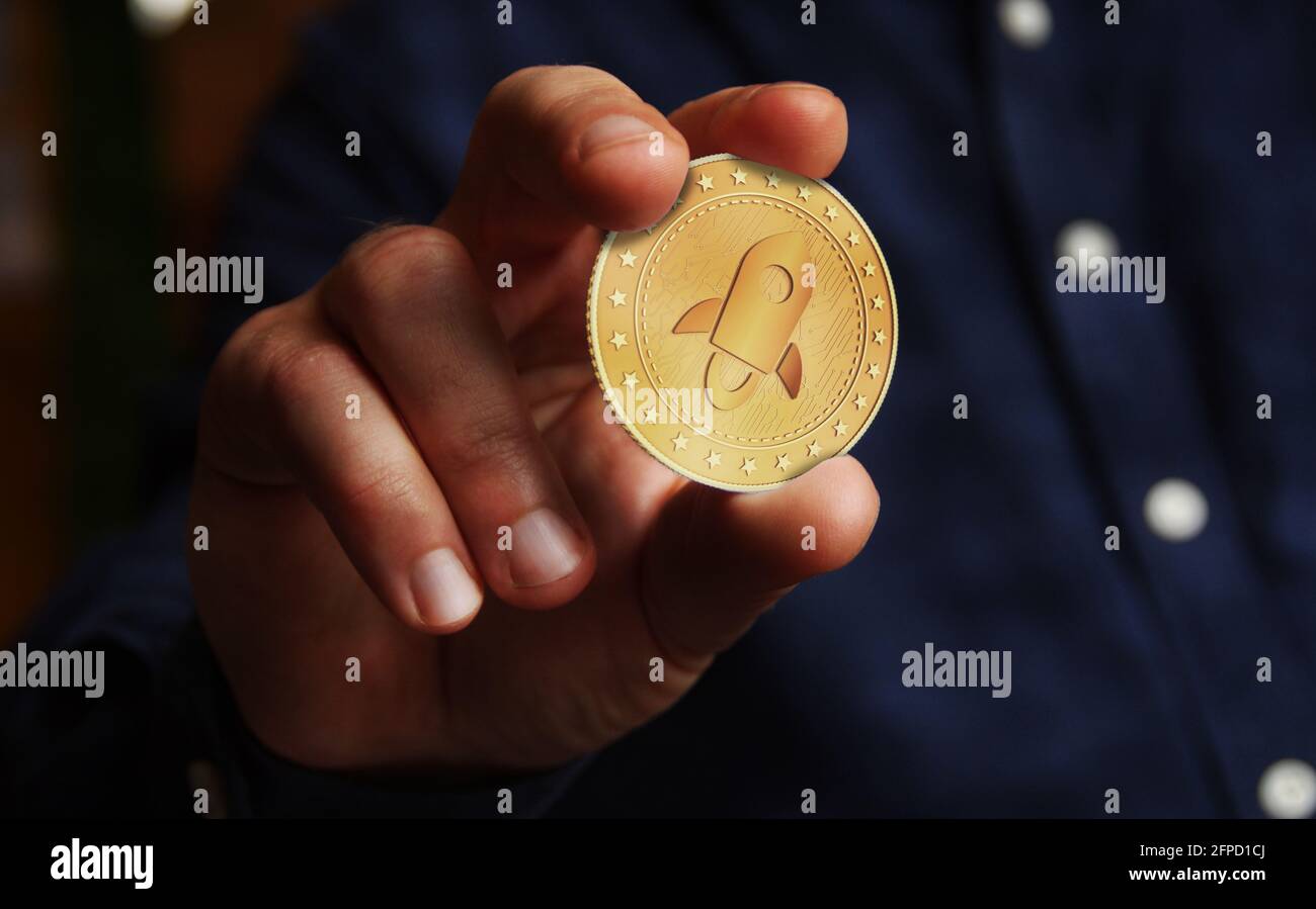 Stellar XLM cryptocurrency symbol golden coin in hand abstract concept ...