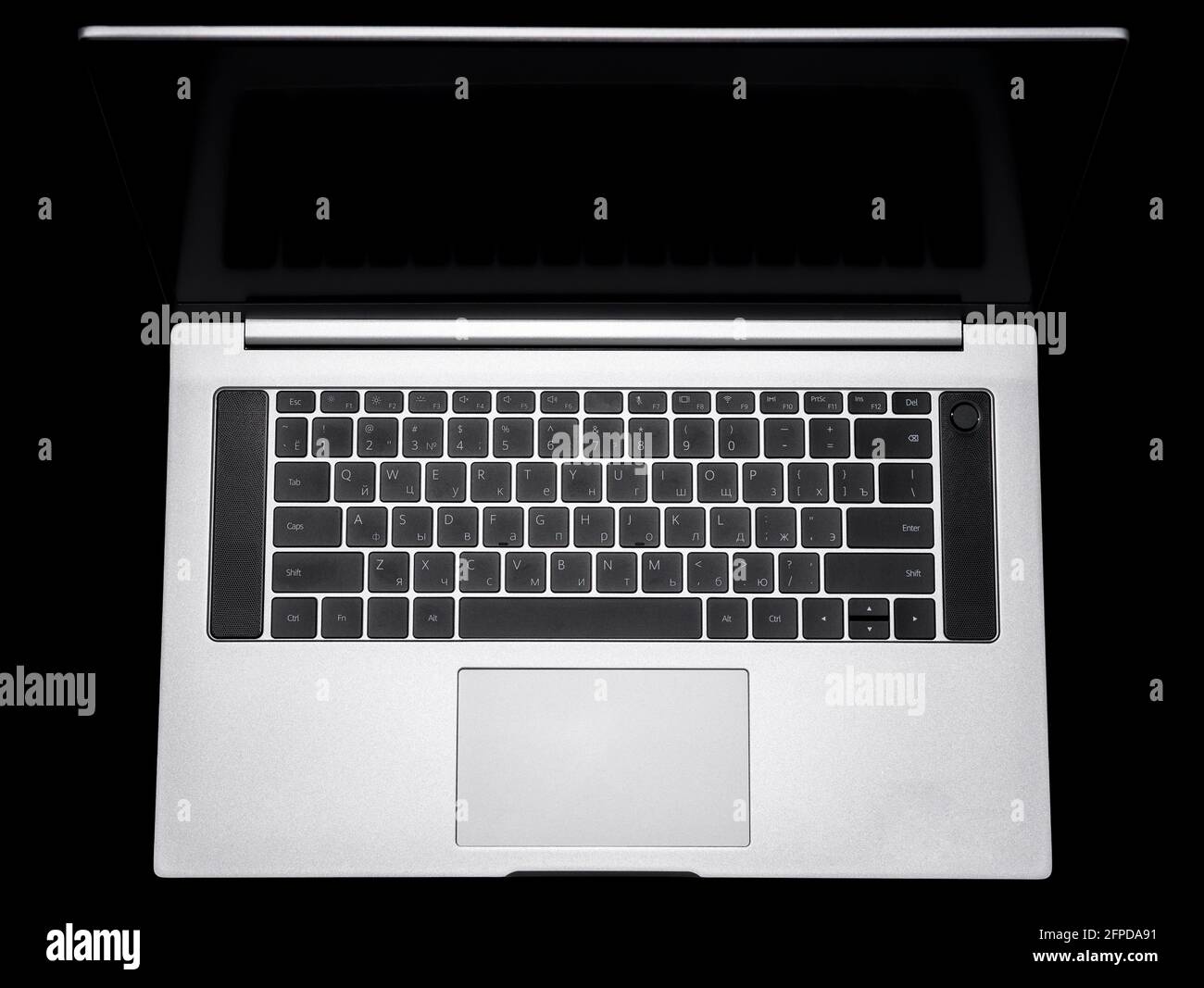 Silver Laptop and keyboard against a black background. Laptop keyboard ...