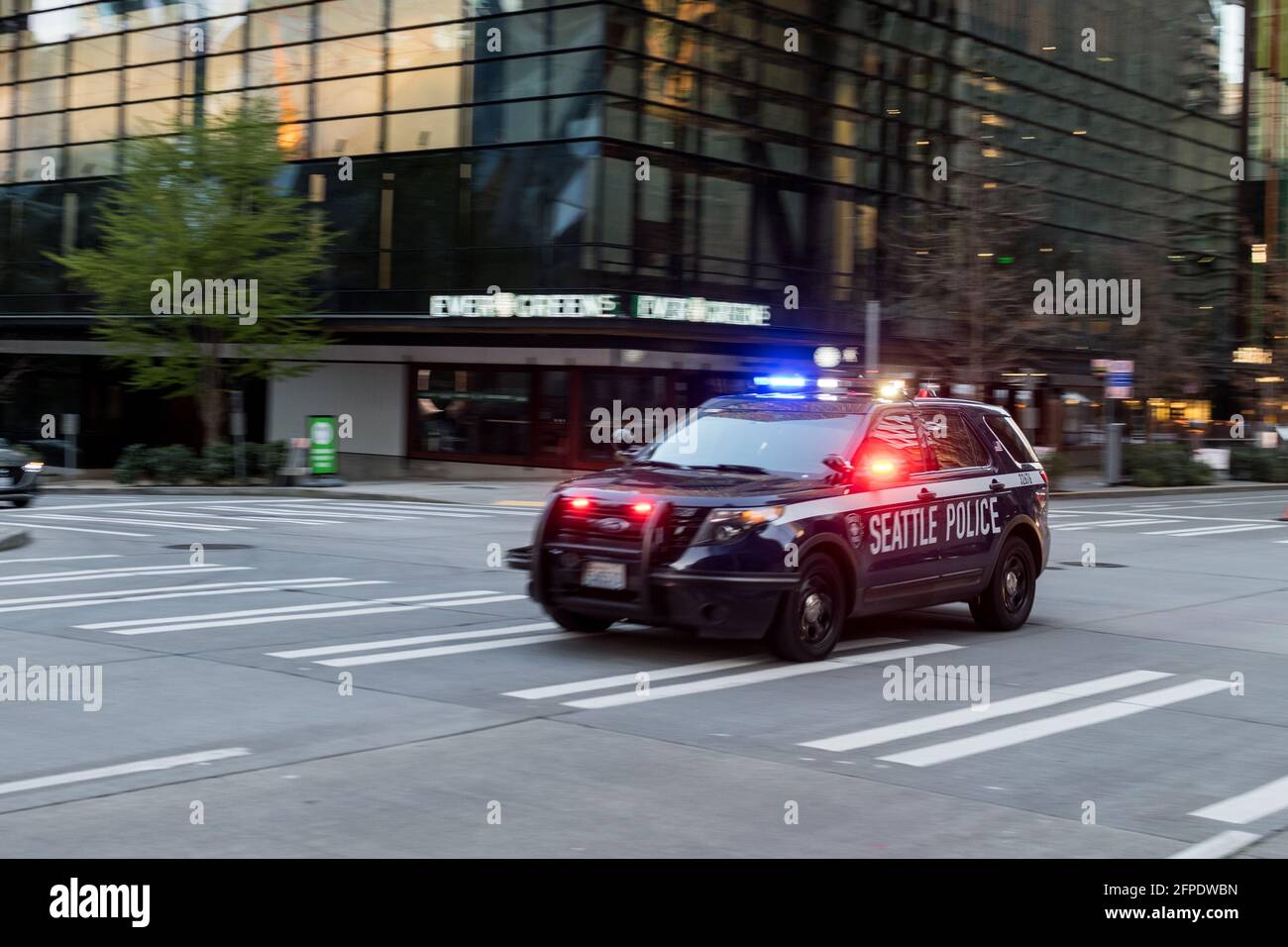 Seattle, USA. 5th Apr, 2021. A police car passing the Amazon campus in ...