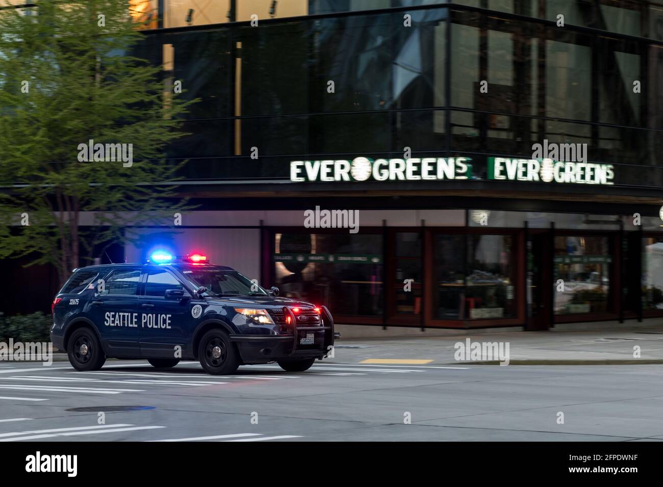 Seattle, USA. 5th Apr, 2021. A police car passing the Amazon campus in ...