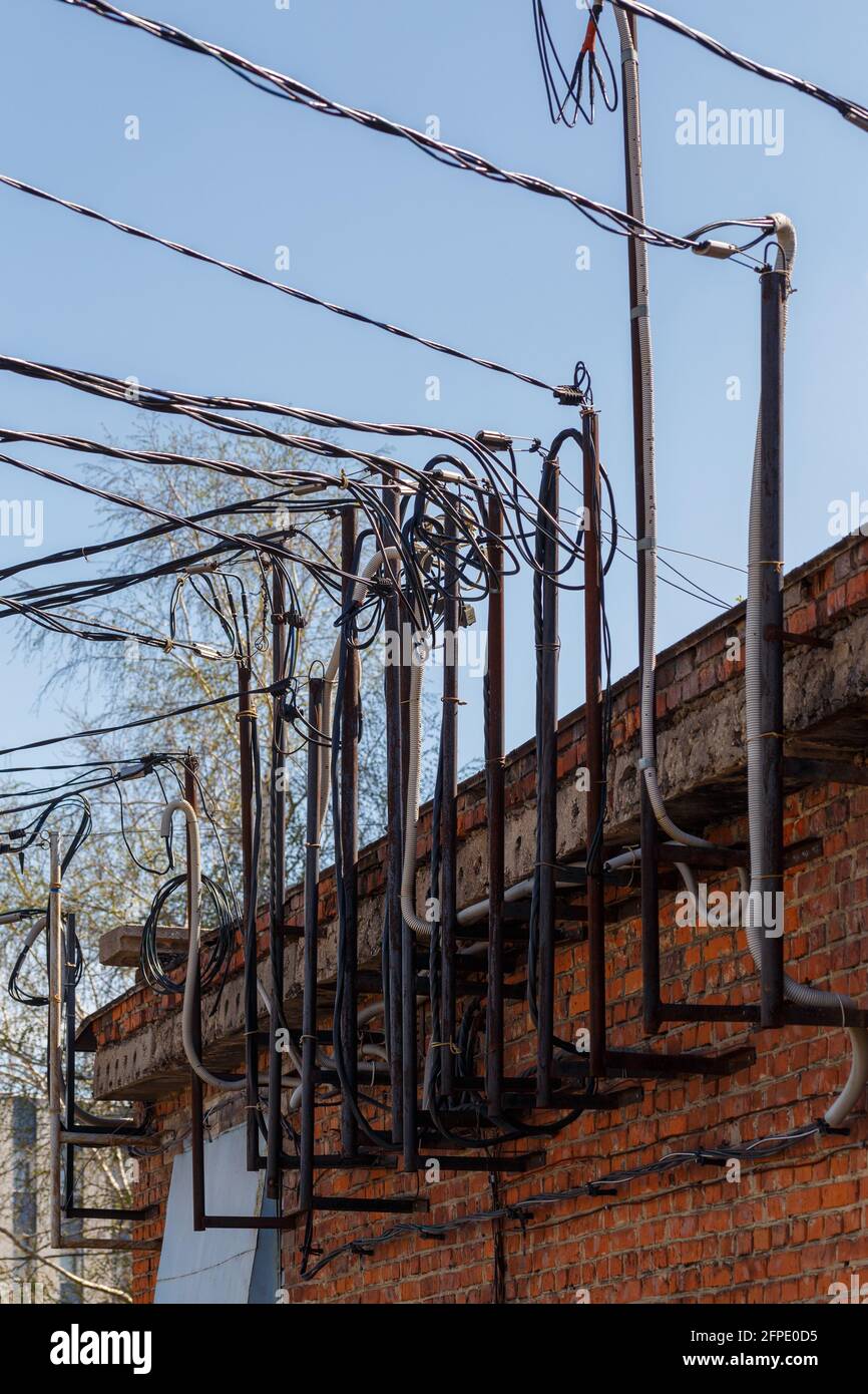 lots of wires sticking out of an old brick electrical substation ...