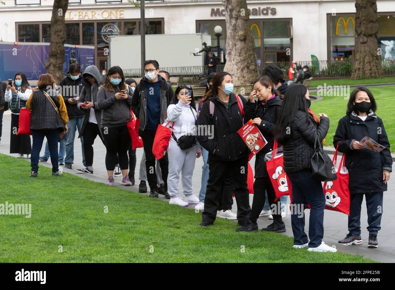 20 May 2021 .London, United Kingdom. Customers queue up to enter the ...