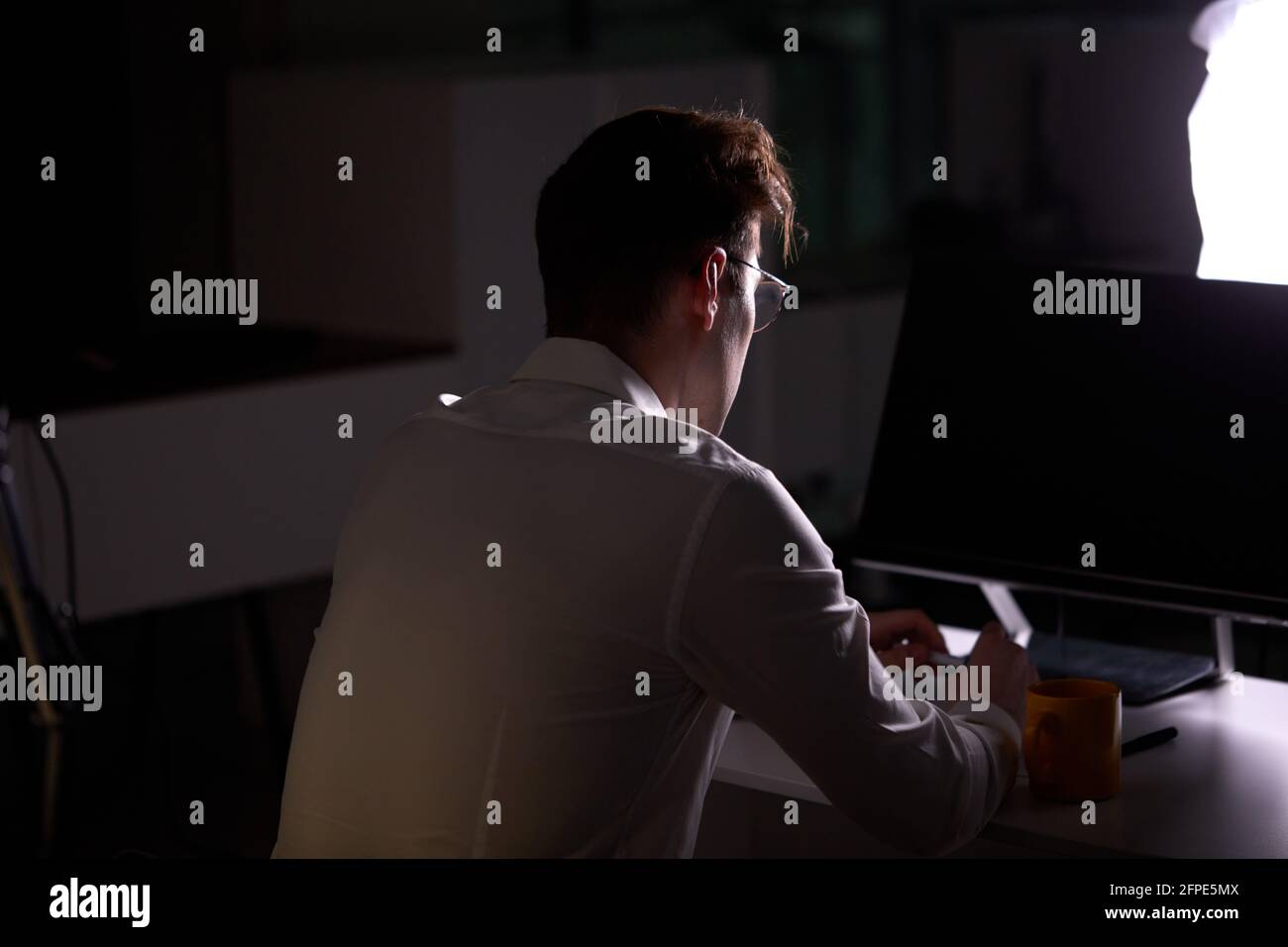 Unrecognizable Male Programmer Writing Code on Computer at Night. Side ...