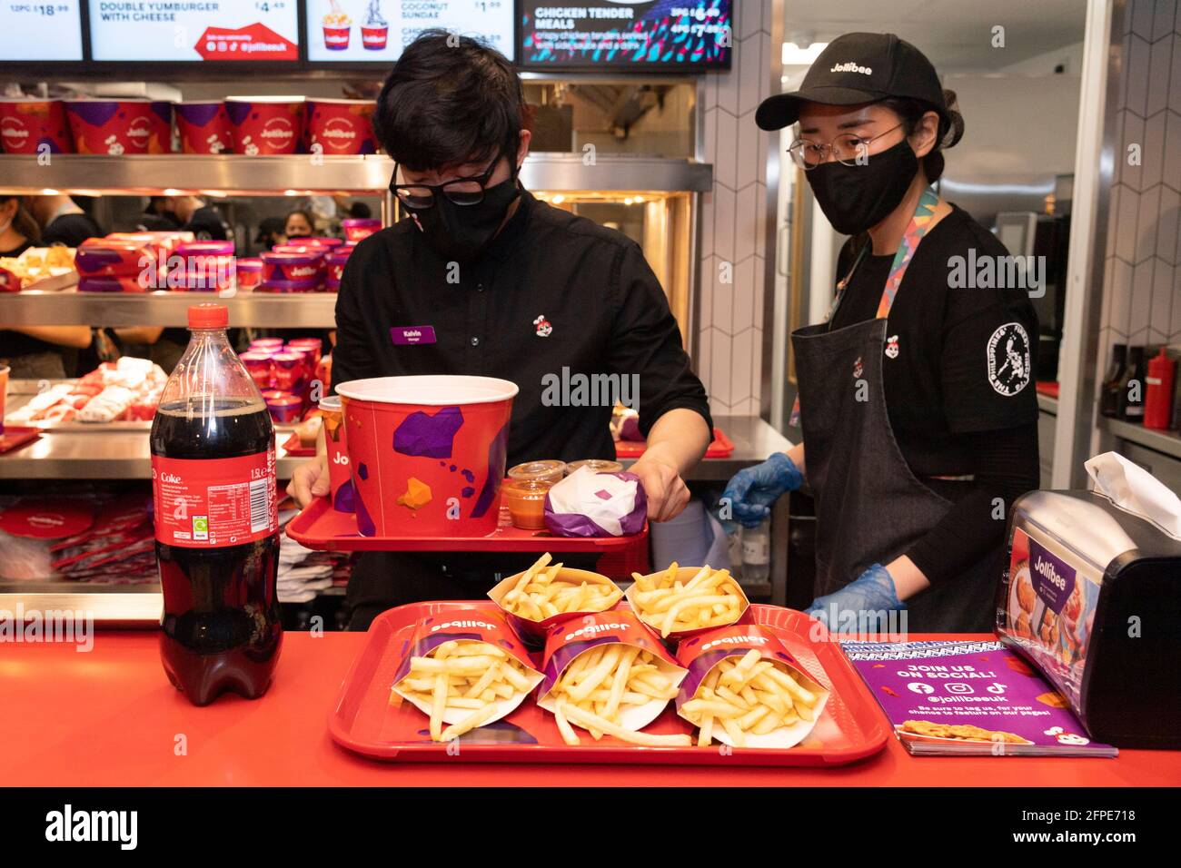 20 May 2021. London, UK. Staff prepare food orders for customers at the ...