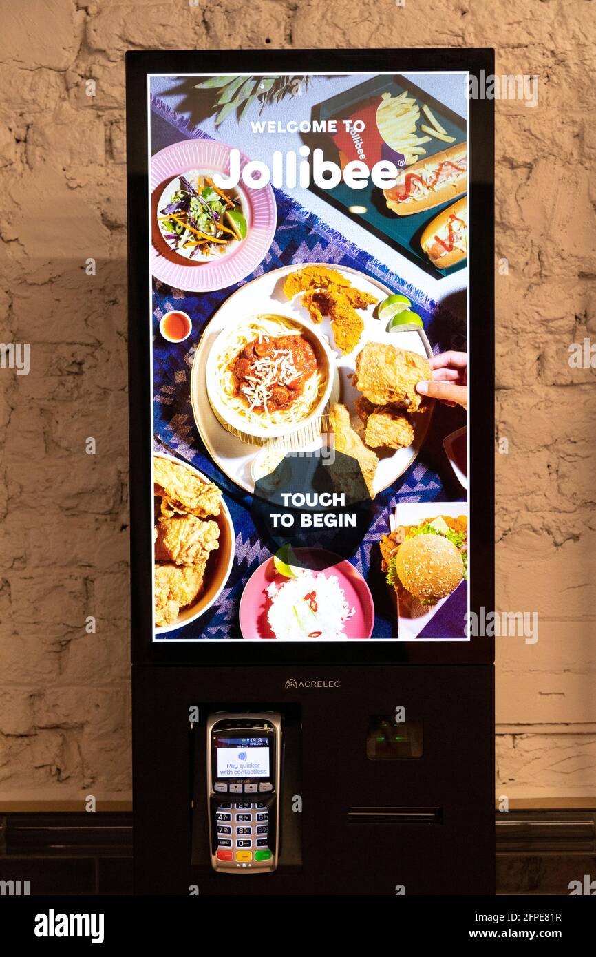 20 May 2021. London, UK. Customer order machine in the new Jollibee ...