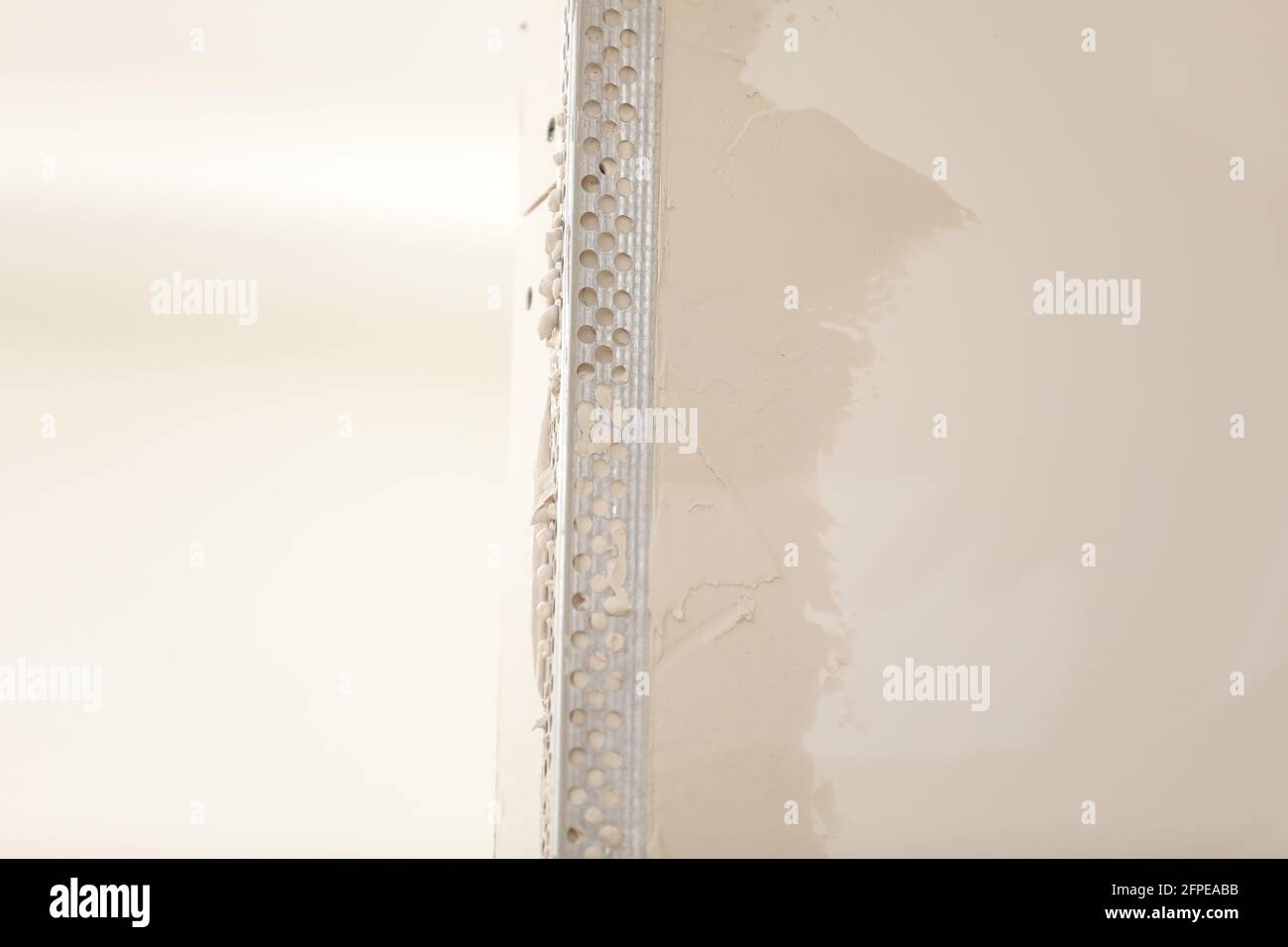 The worker set the metal wall profile in the new flat. Plasterboard ...