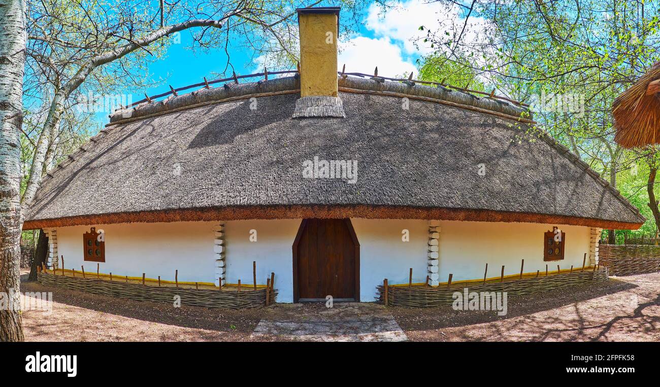 Panorama of traditional Ukrainian whitewashed hata house with tatched ...