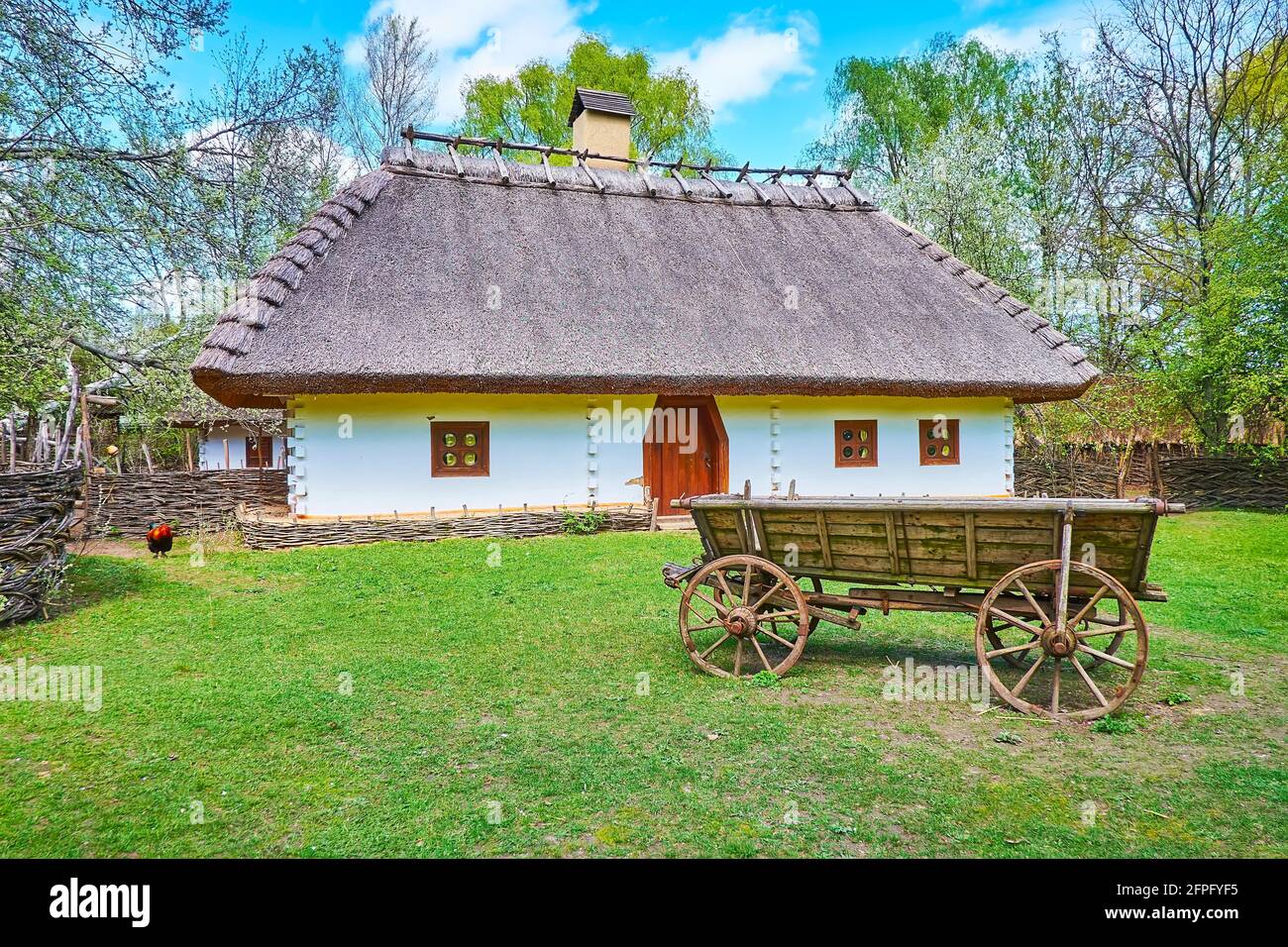 The wooden cart and a facade of traditional hata house of typic ...