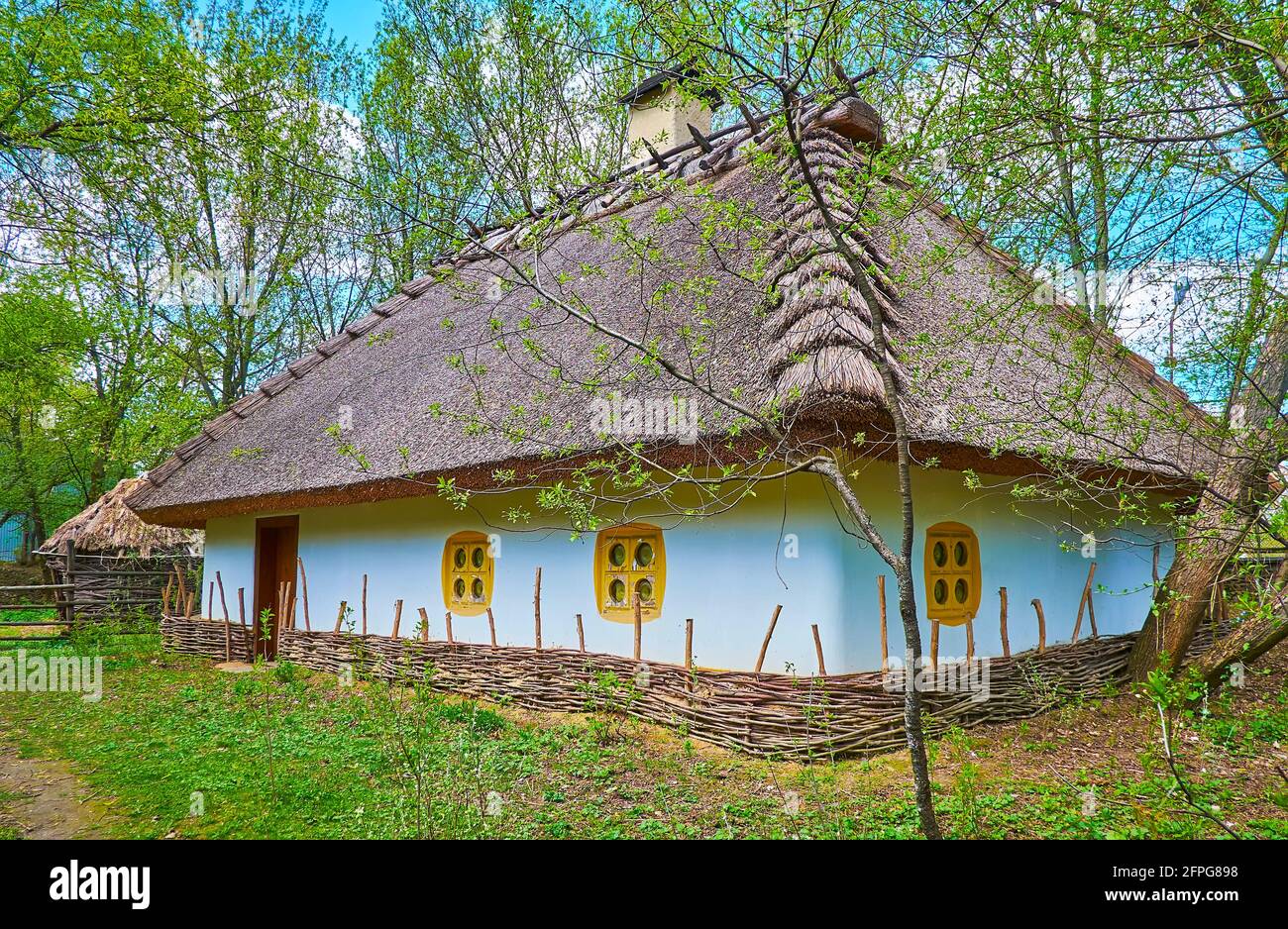 The authentic Ukrainian rural hata house with whitewashed walls ...