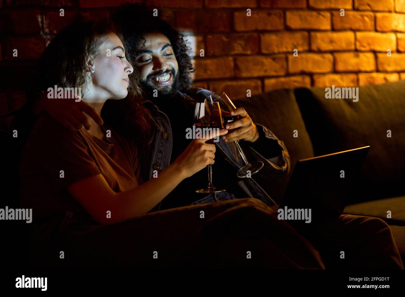 married couple watching movie on laptop, relaxing and watching movies ...