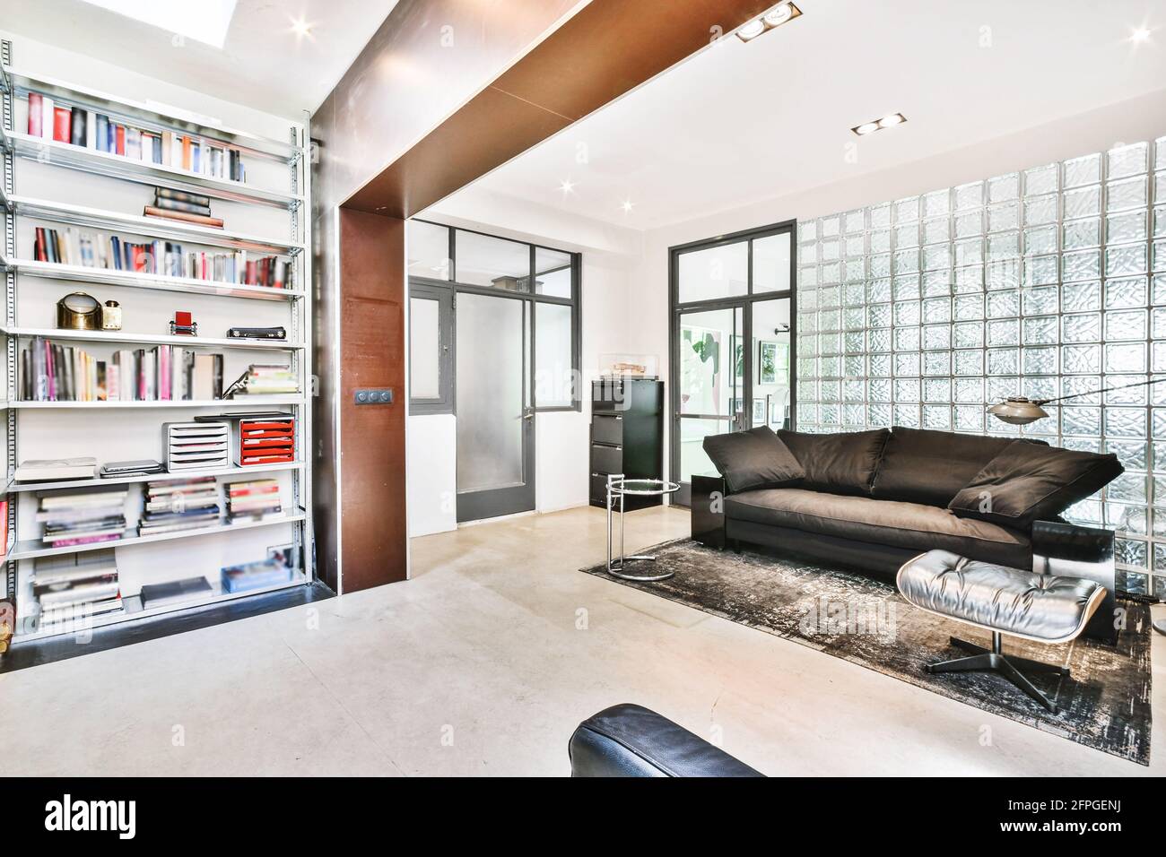 Cozy interior design of spacious home library with comfortable sofa and ...