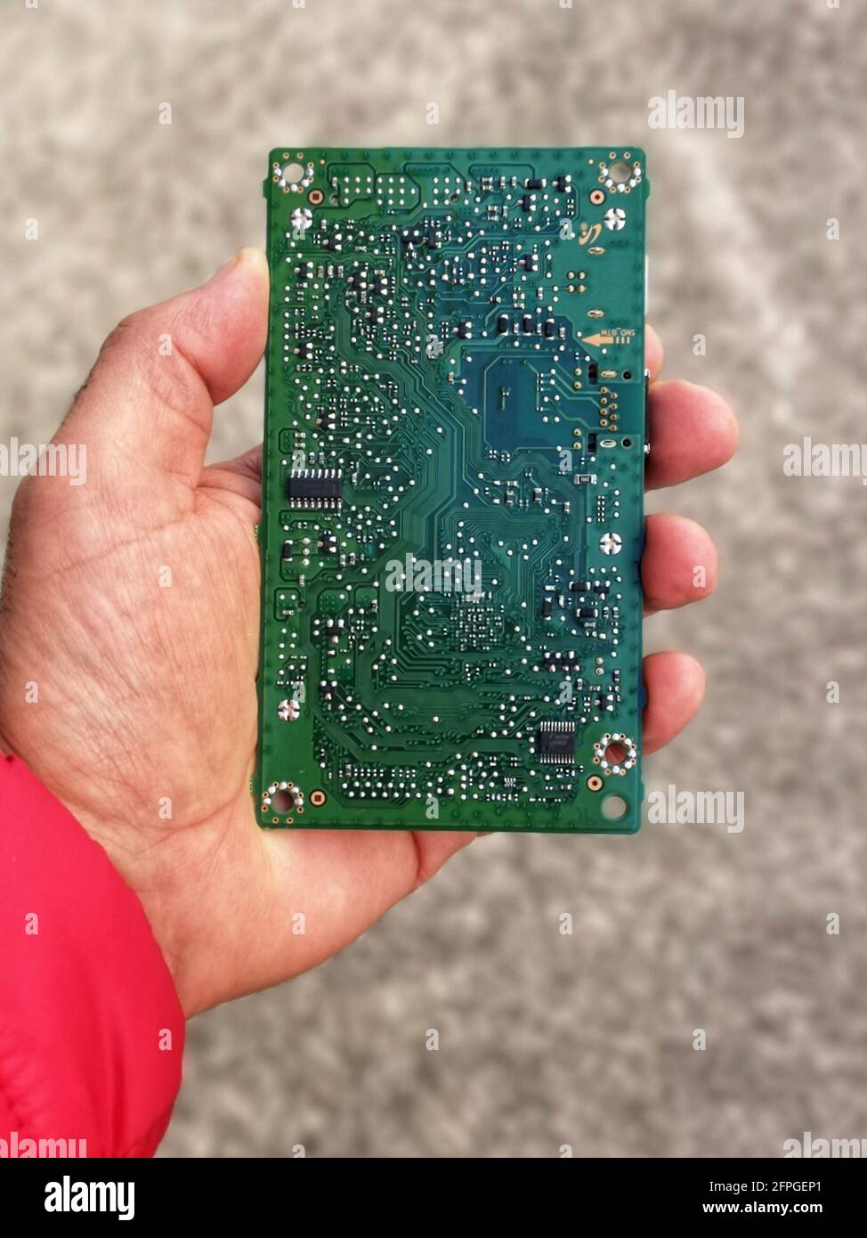 Green silicon chip on a human hand Stock Photo - Alamy
