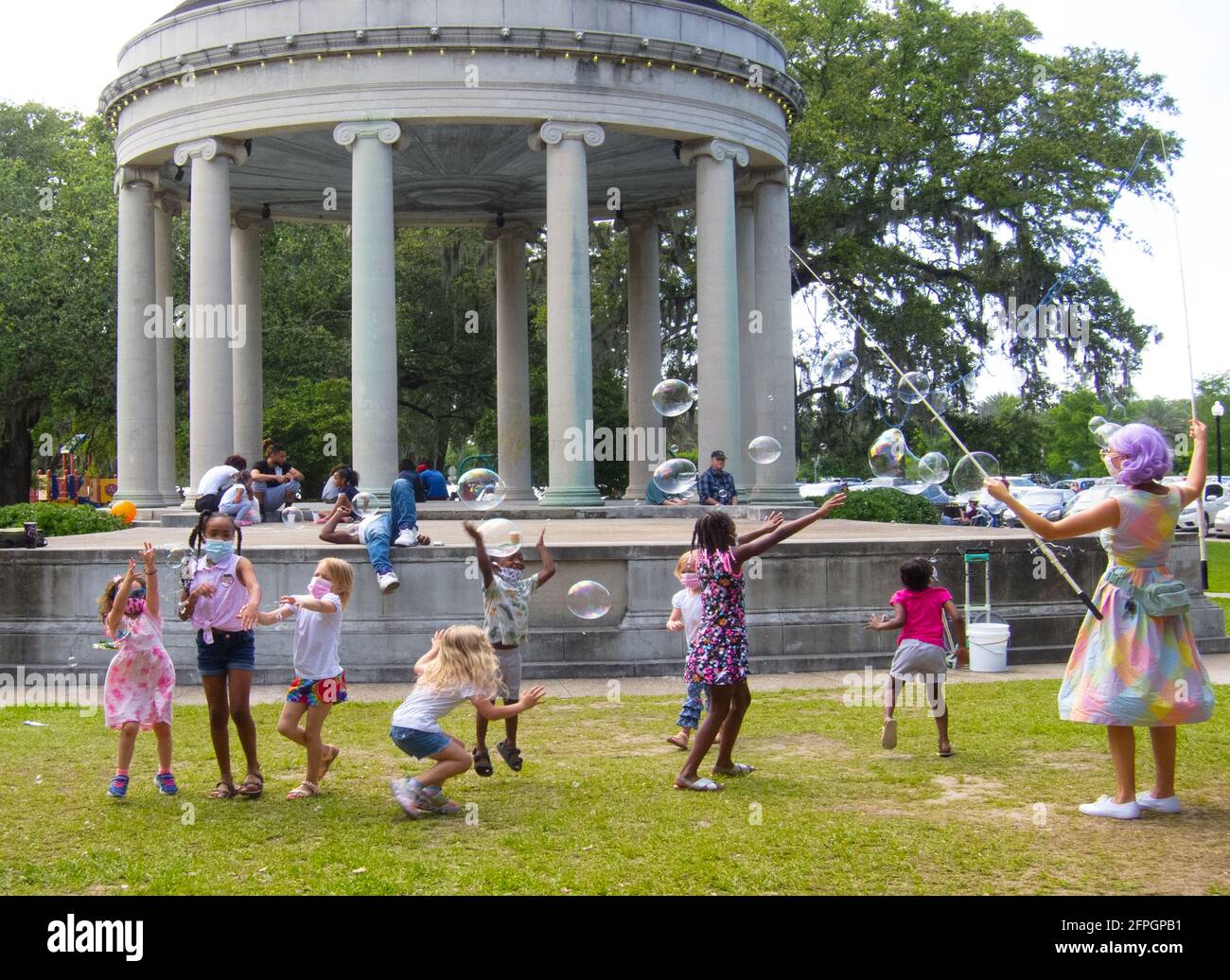 Kids chasing bubbles hi-res stock photography and images - Alamy