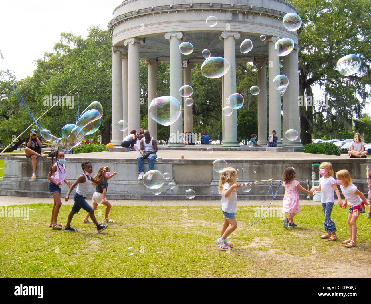 Kids chasing bubbles hi-res stock photography and images - Alamy