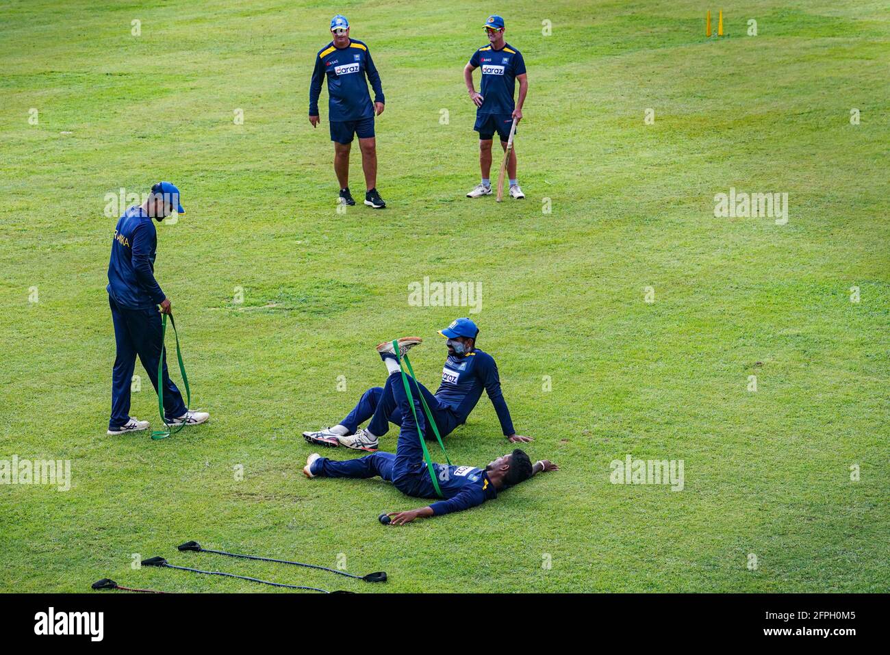 Sri Lankan cricketers stretch during a training session at the Sher-e ...