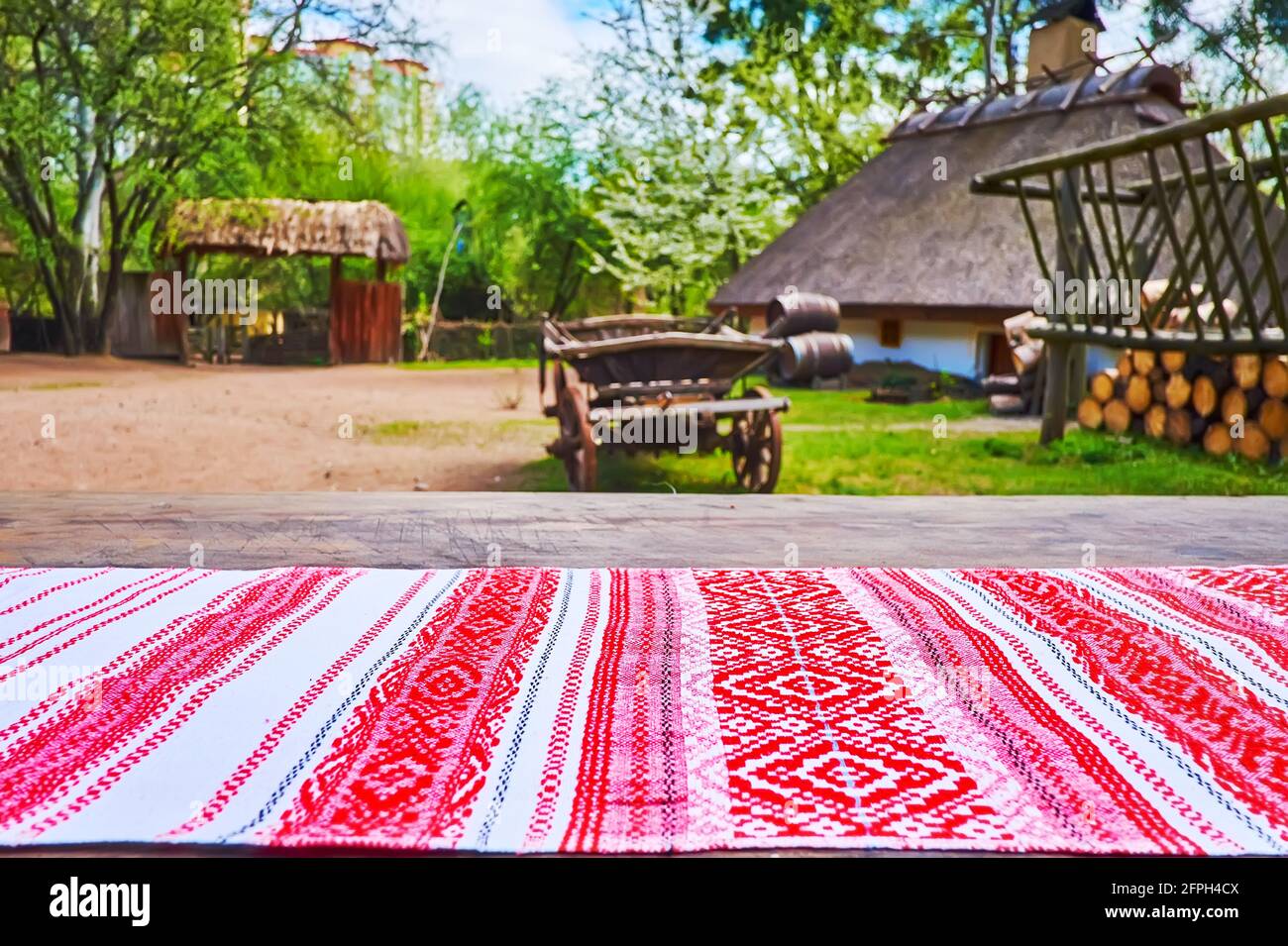 The table in front of the rural court is covered with traditional ...
