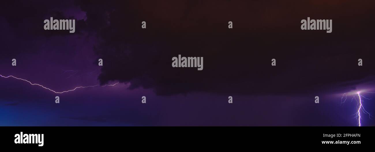 Lightning storm with dramatic purple color Stock Photo - Alamy