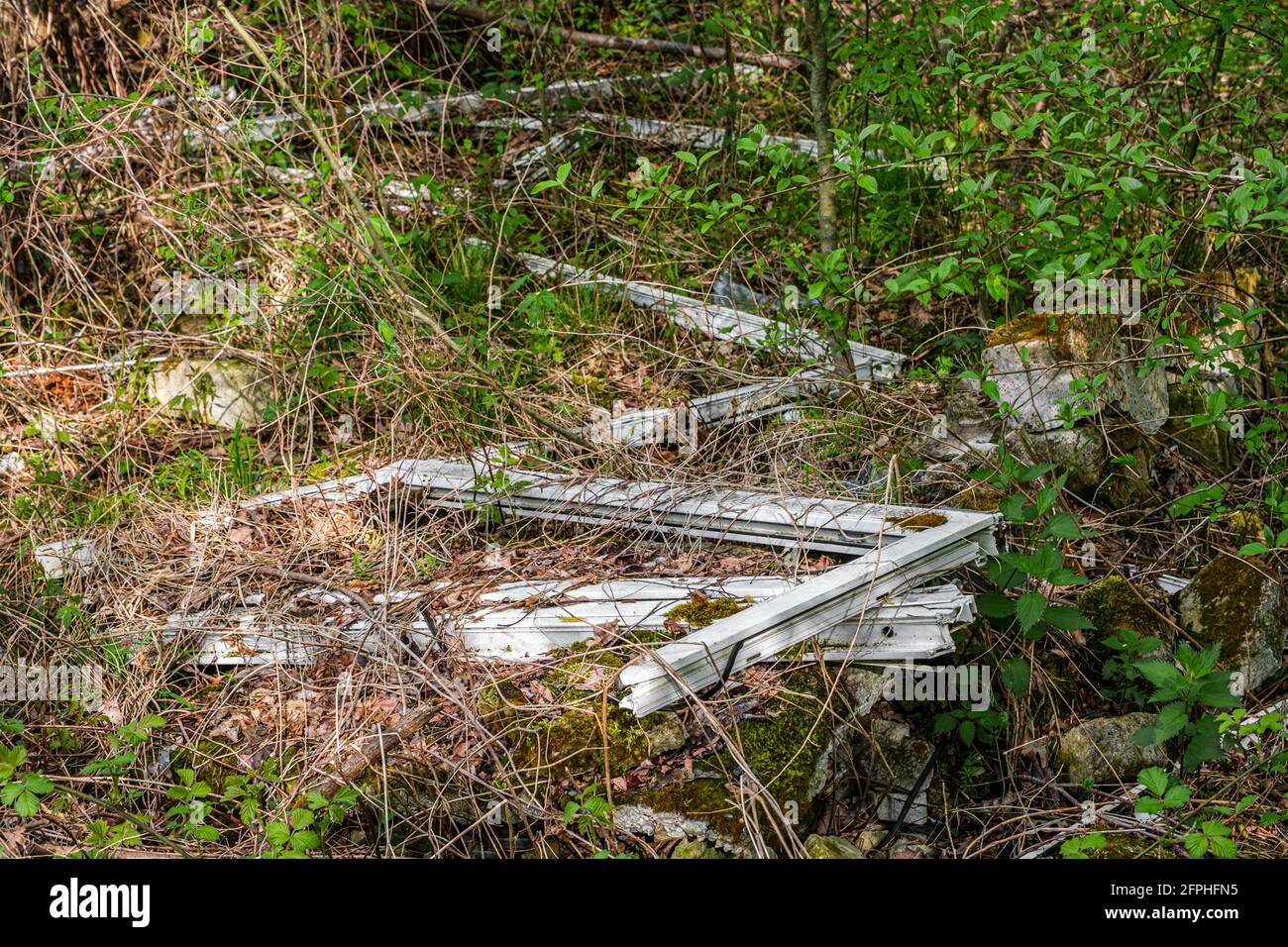 PVC window frames discarded in nature Stock Photo - Alamy