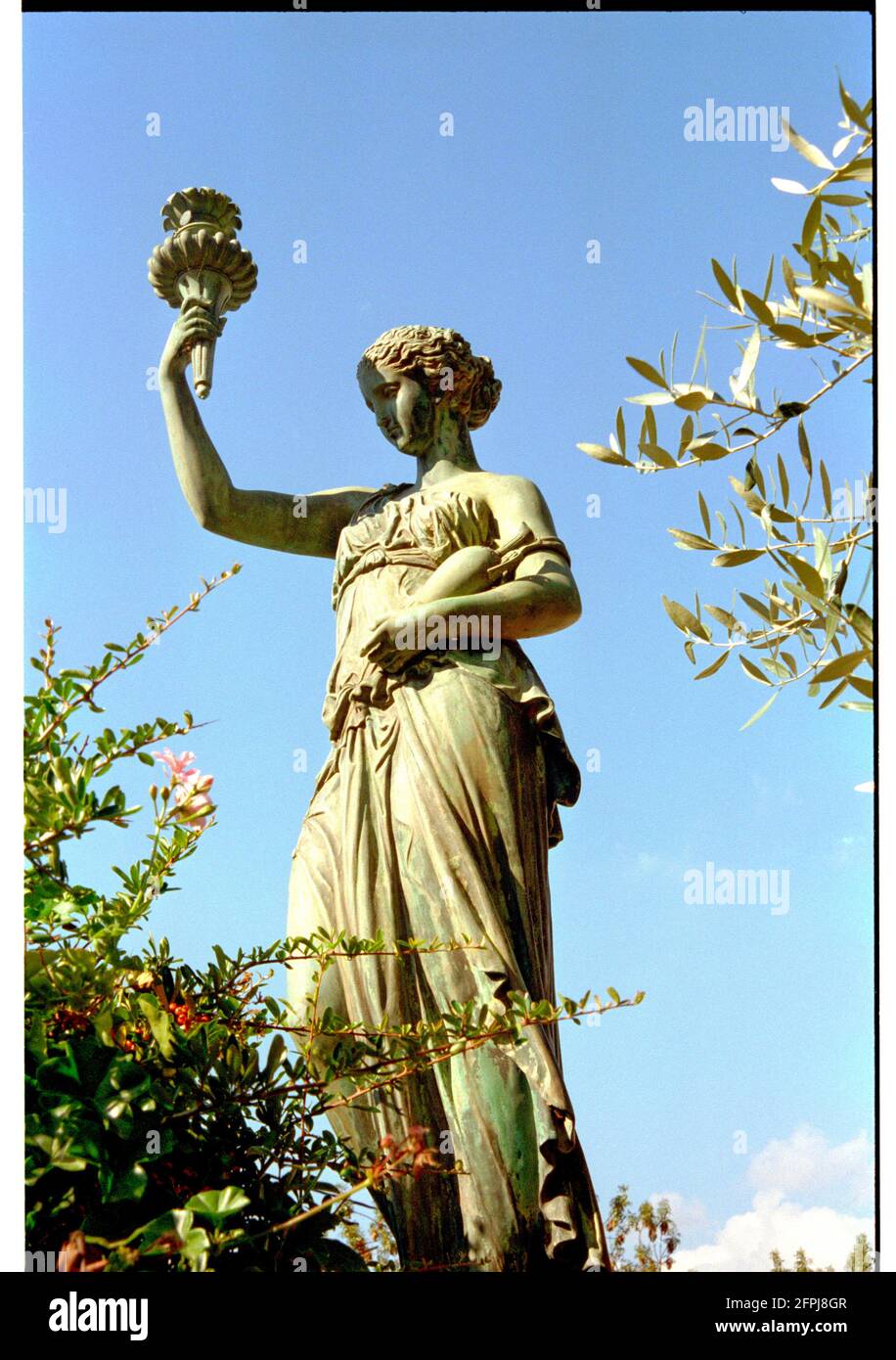 Lamppost statue in a garden Stock Photo - Alamy