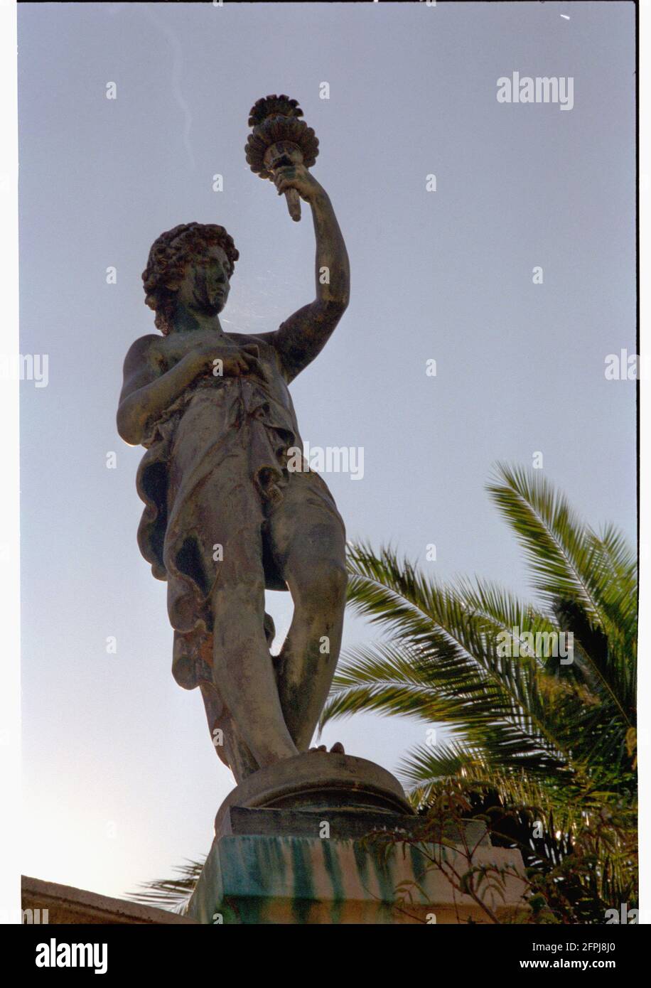 Lamppost statue in a garden Stock Photo - Alamy