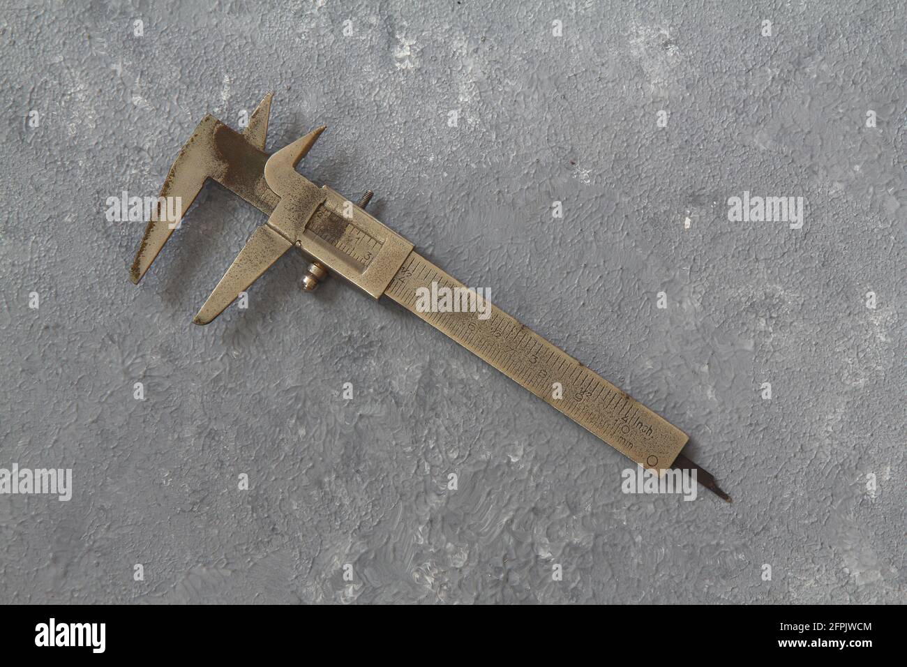Very old used rusty iron calipers isolated on stone background Stock ...