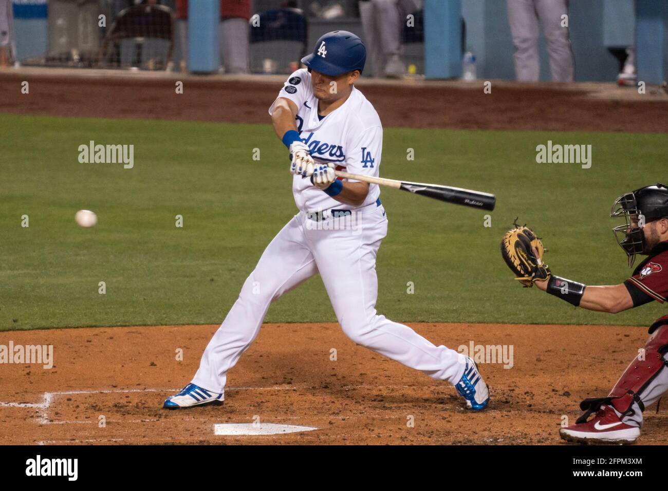 Los Angeles Dodgers first baseman Yoshi Tsutsugo (28) singles and ...