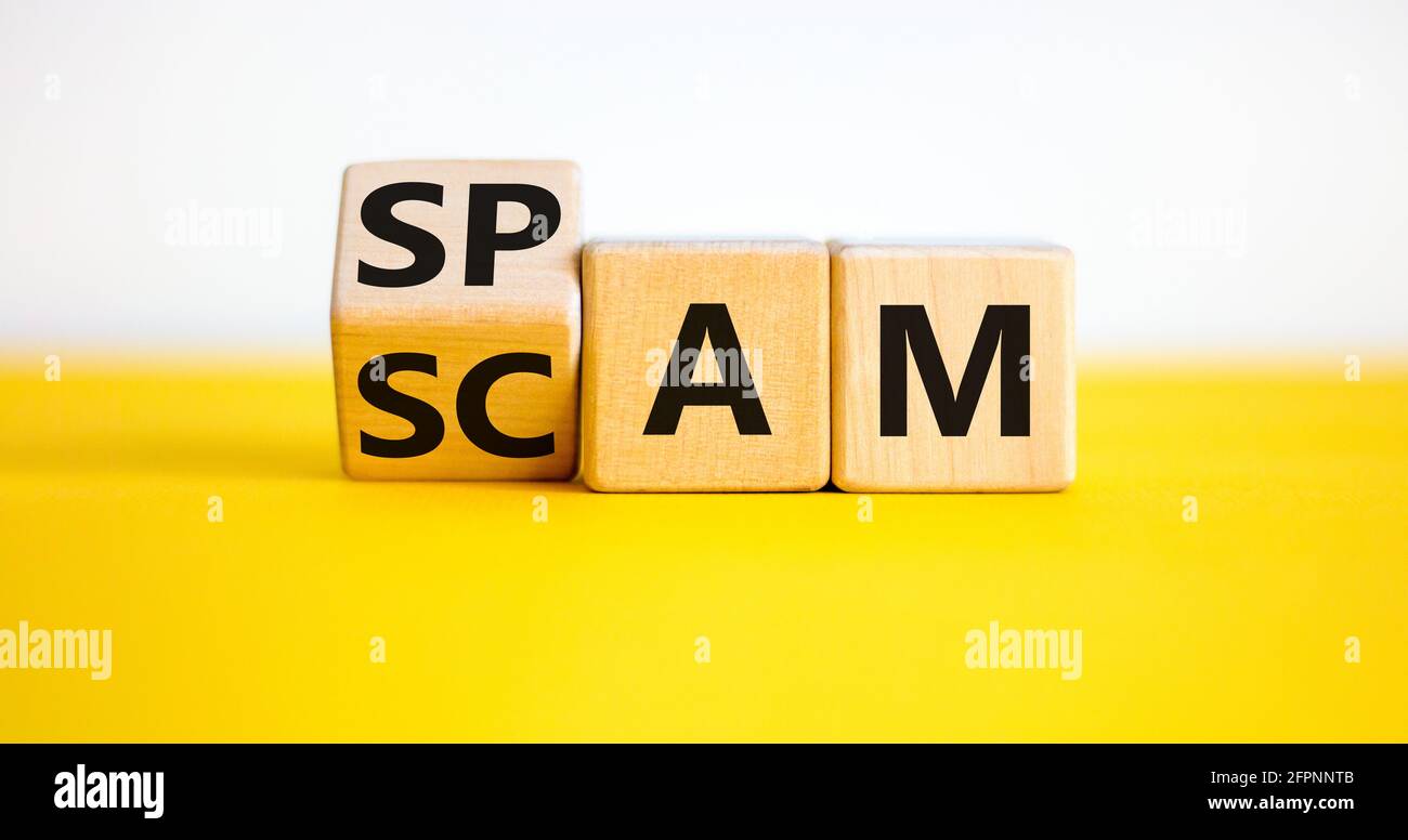 Spam and scam symbol. Turned a wooden cube and changed the word 'scam ...