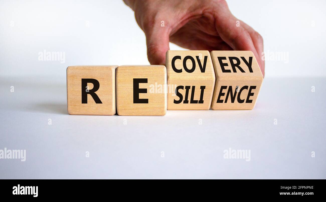 Recovery and resilience symbol. Businessman turns cubes and changes the ...