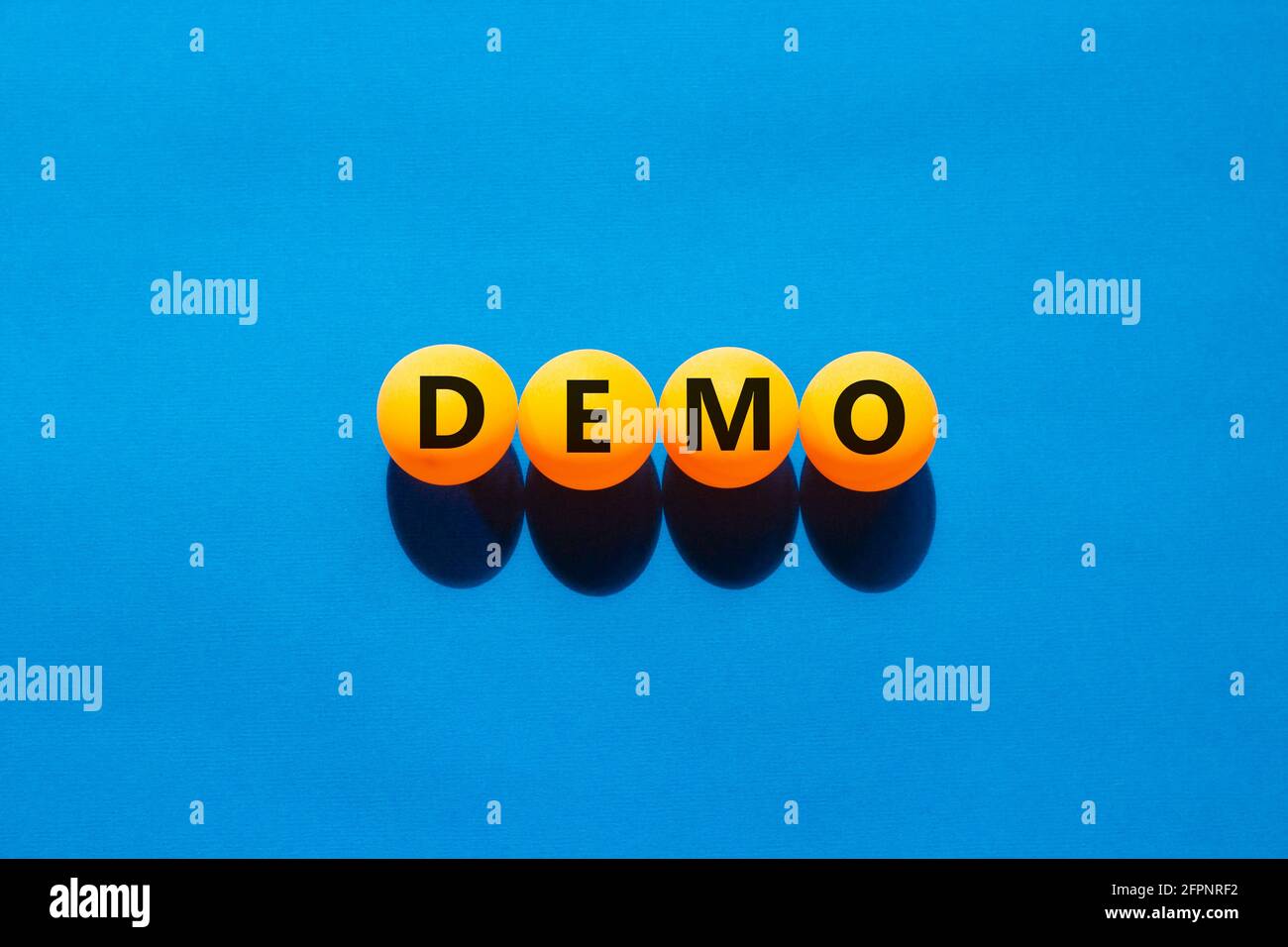 Business and demo symbol. Orange table tennis balls with the word 'demo ...