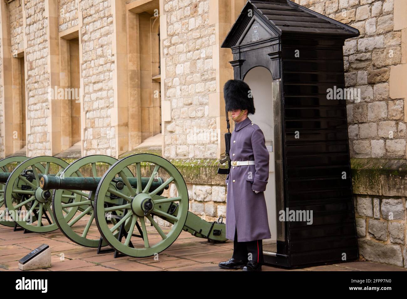 London, UK - January 27, 2017: A close up of guard near cannon at the ...