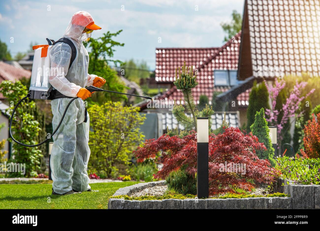 Caucasian Gardener in His 40s Wearing Protection Uniform, Safety ...