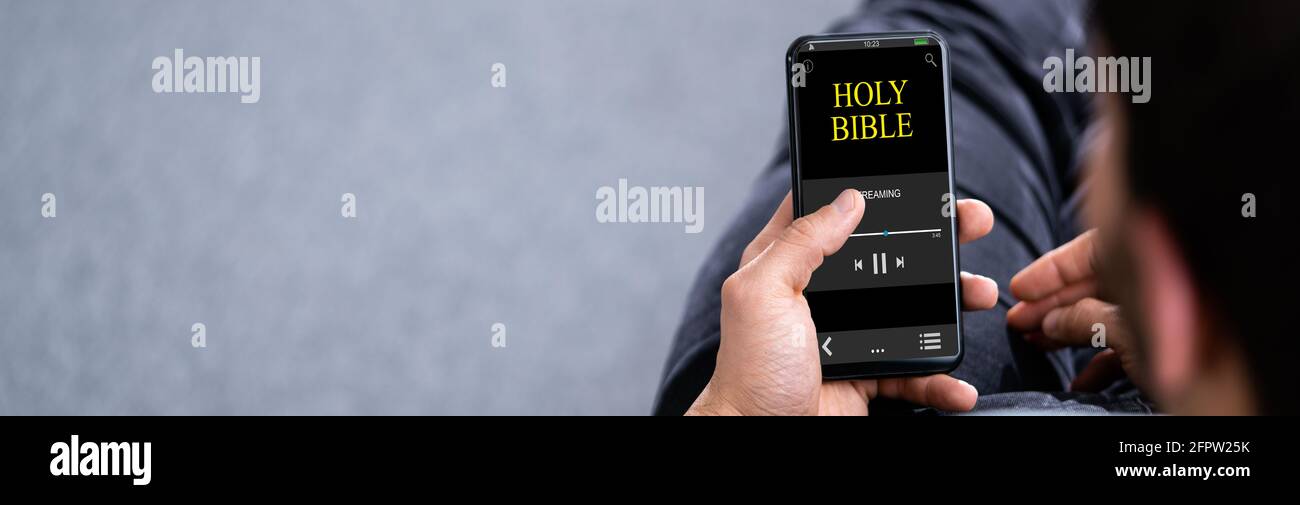 Bible Praying Audiobook On Phone. Listening And Praying Stock Photo - Alamy