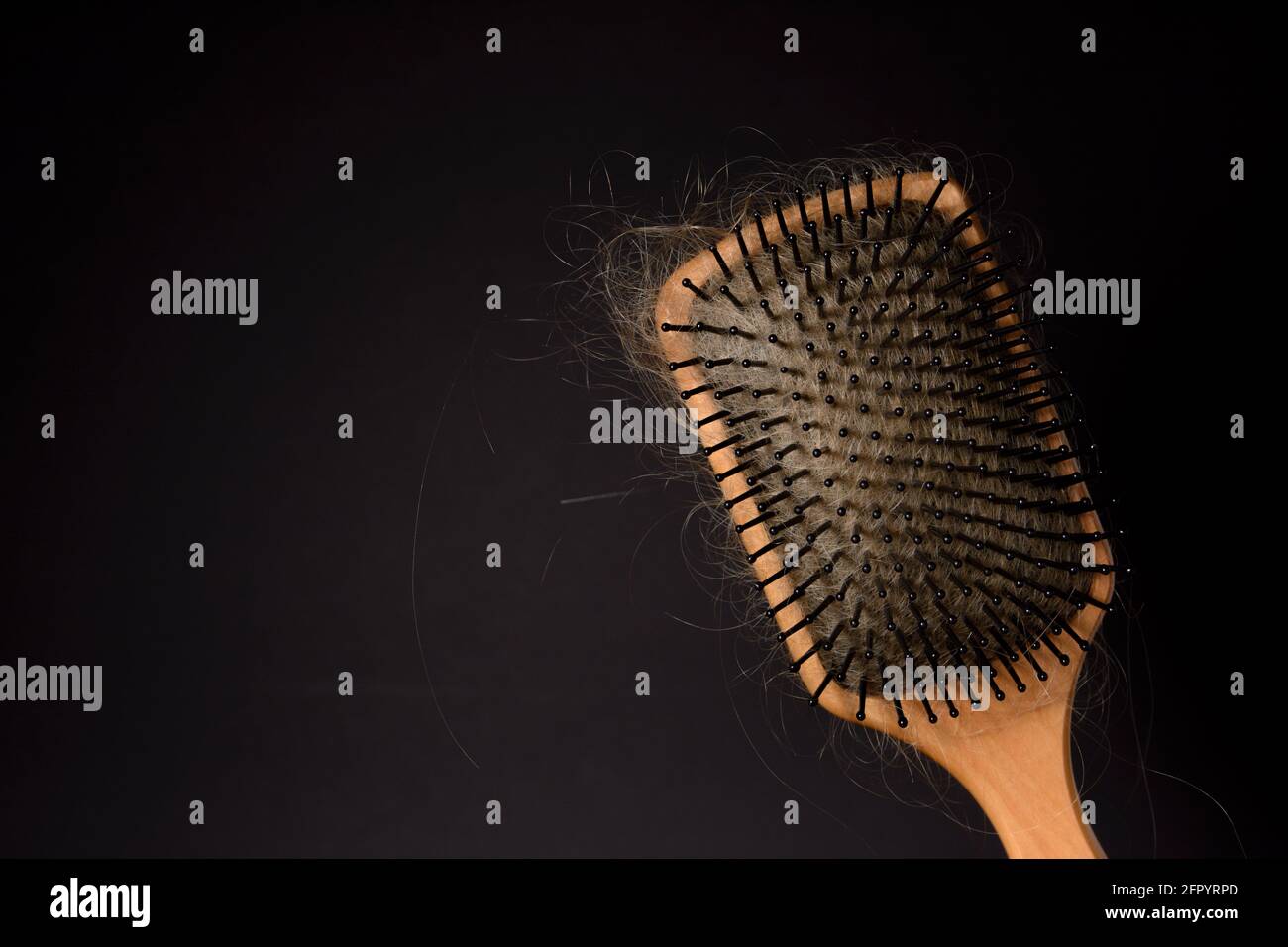 Blond long hair tangled in a wood hair brush Stock Photo - Alamy