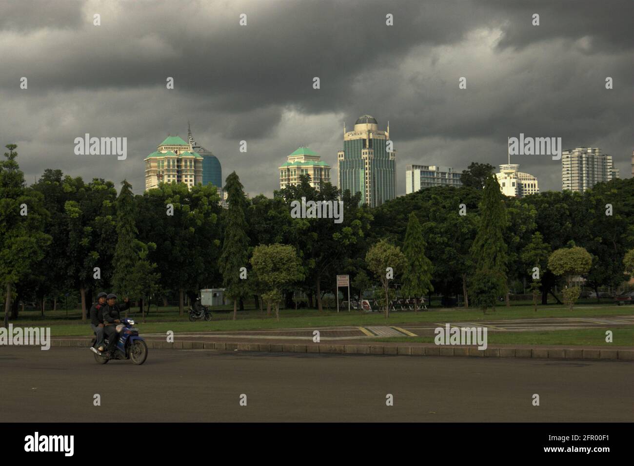 Motorists riding down the road around the east park in Gelora Bung ...