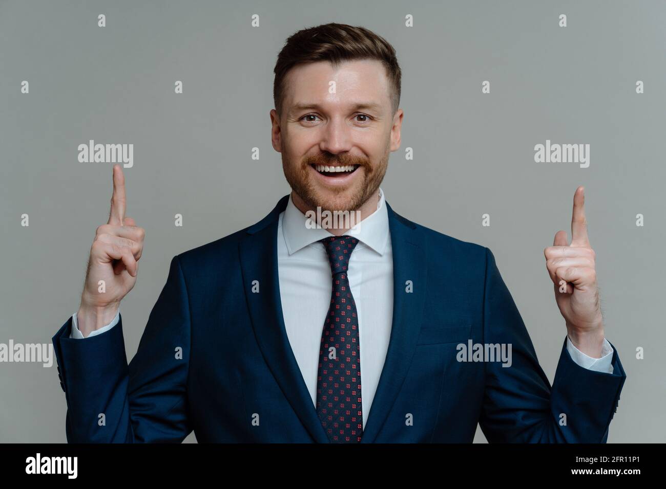 Man showing two fingers suit hi-res stock photography and images - Alamy