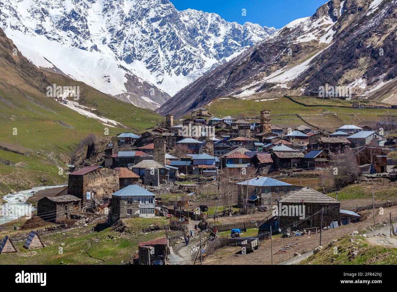 View of the Ushguli village at the foot of Mt. Shkhara. Picturesque and ...