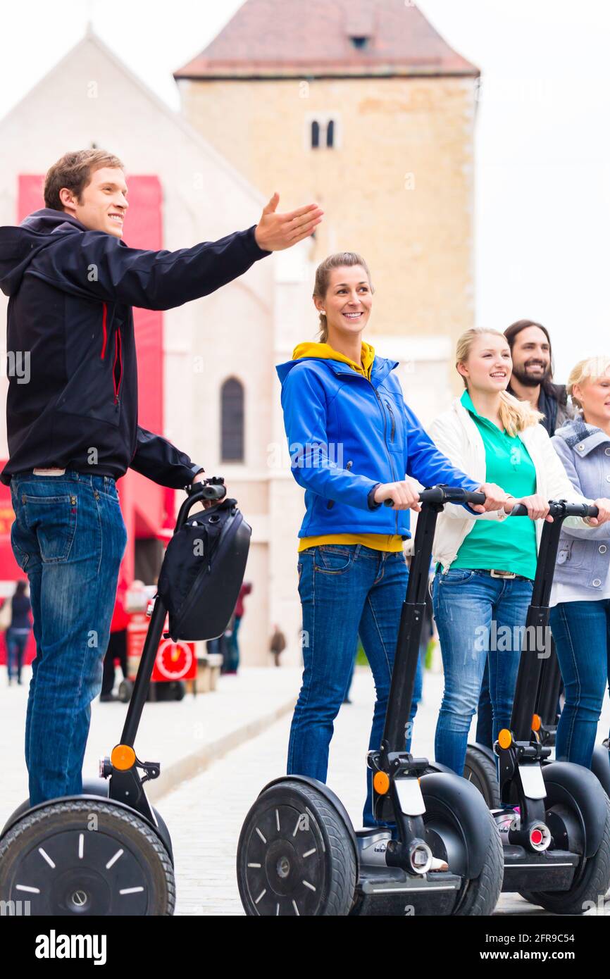 Tourist group having guided Segway city tour in Germany Stock Photo - Alamy