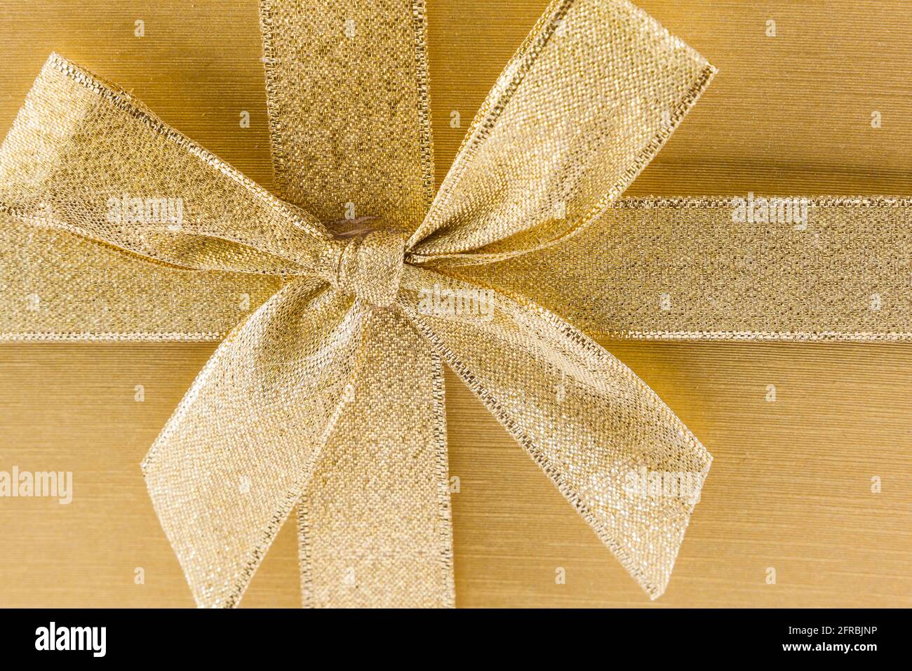 Luxurious gold gift box on white background Stock Photo - Alamy