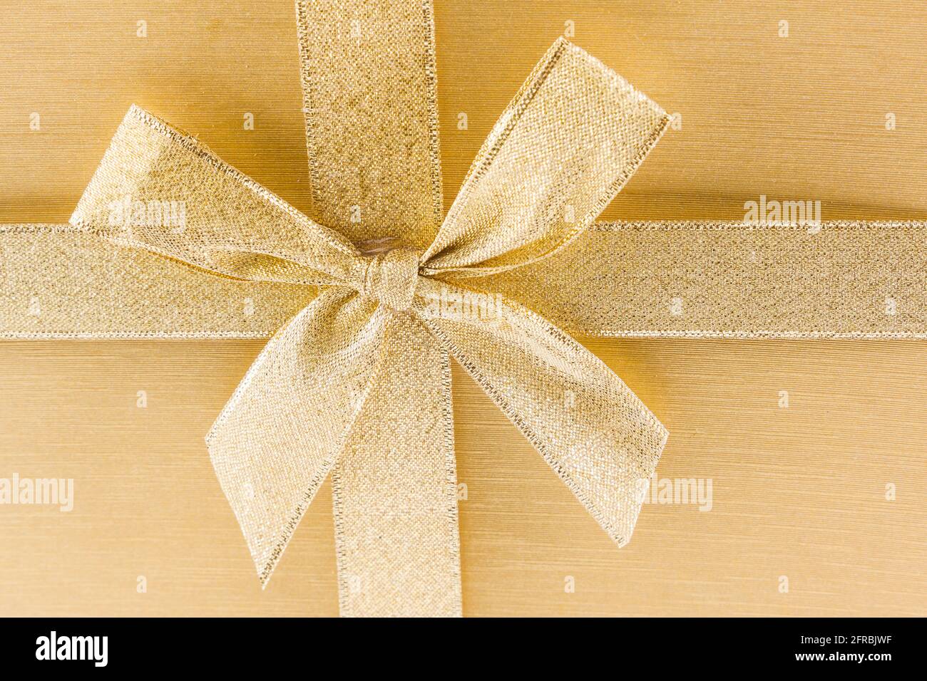 Luxurious gold gift box on white background Stock Photo - Alamy