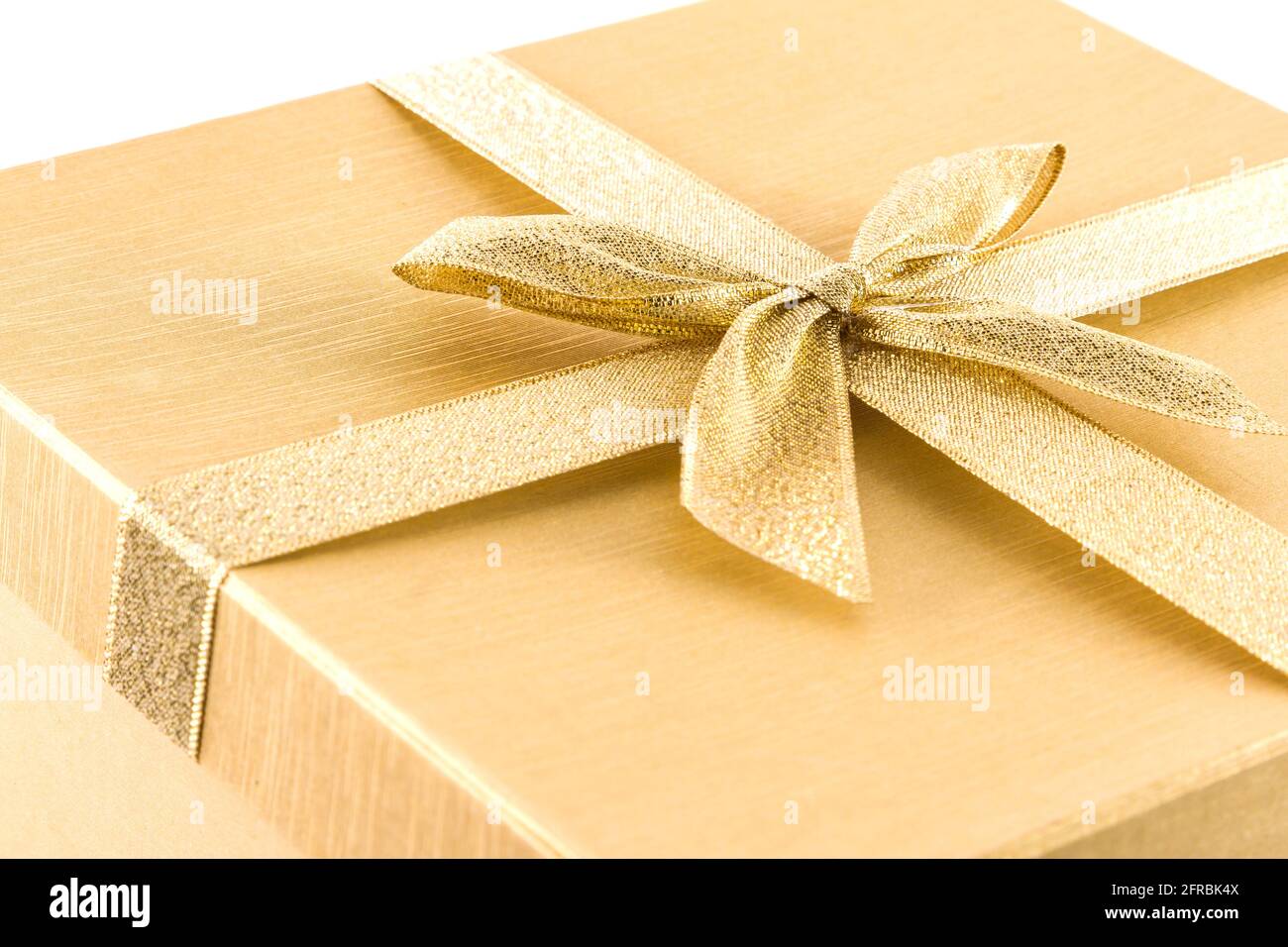 Luxurious gold gift box on white background Stock Photo - Alamy