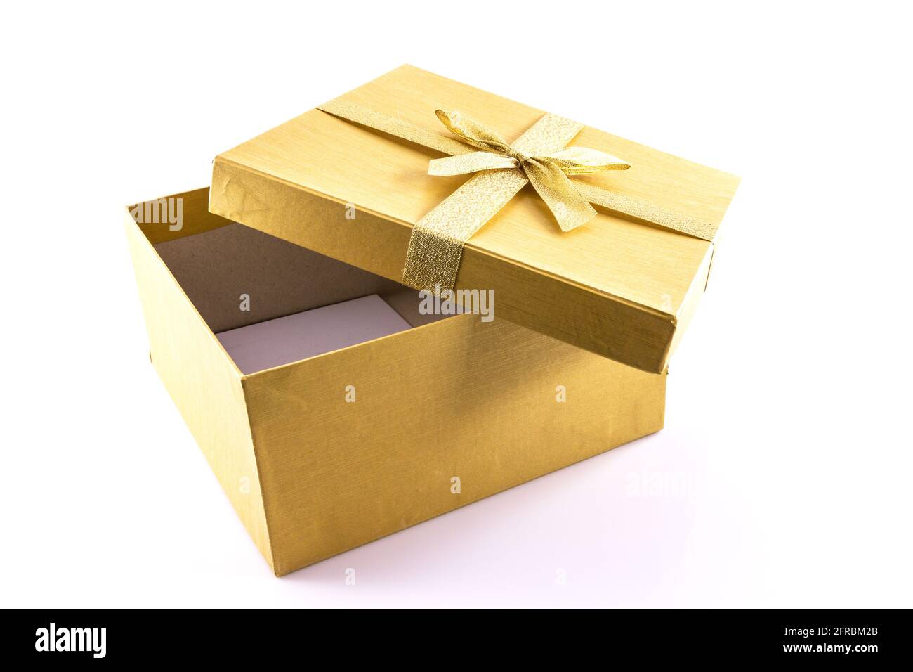 Luxurious gold gift box on white background Stock Photo - Alamy