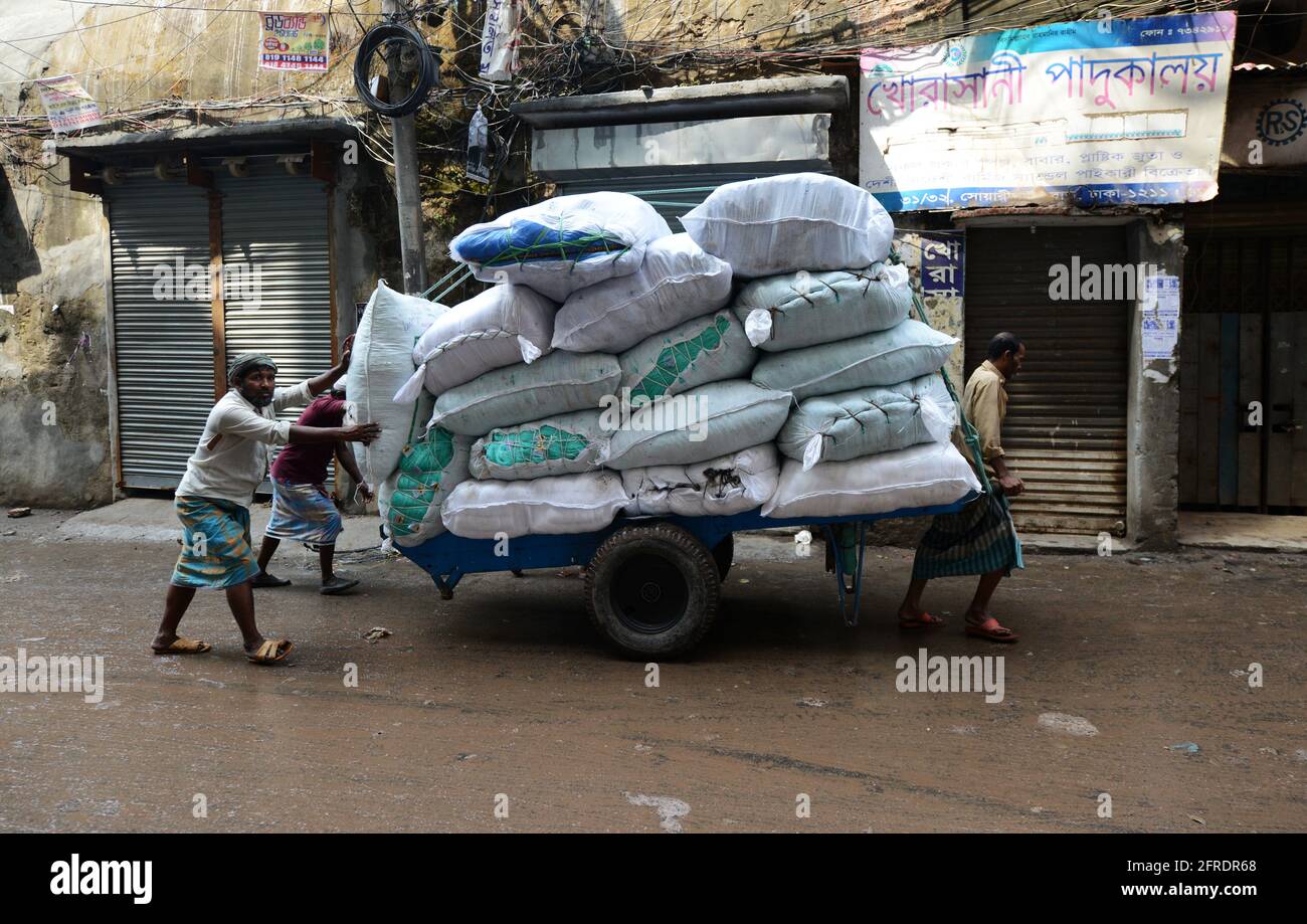 Man pulling cart hi-res stock photography and images - Alamy