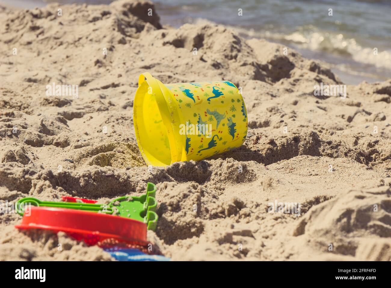 Different shapes made of sand and children toys for relax or playing on ...