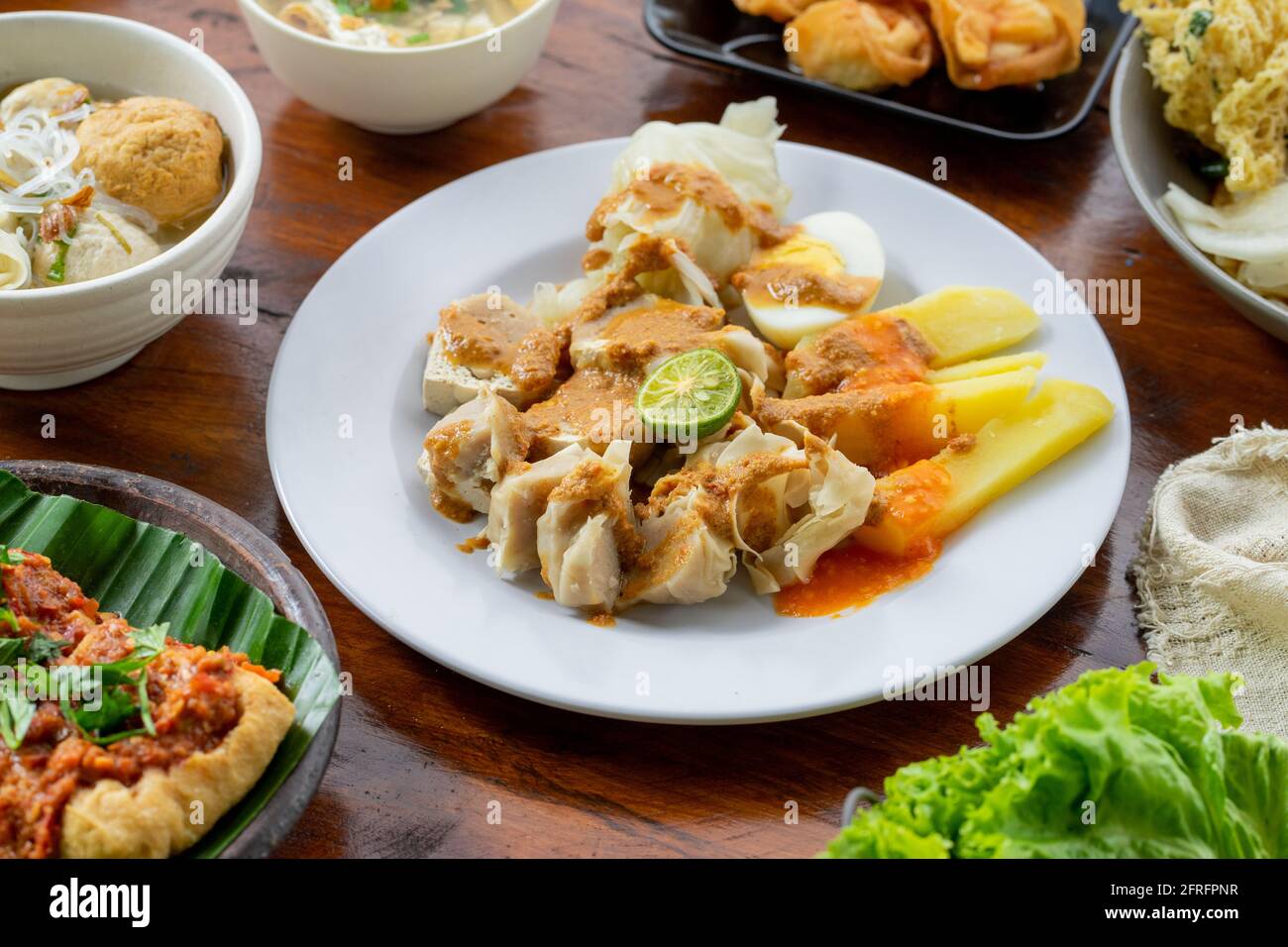 Traditional food presentation - Various Indonesian food is served on ...