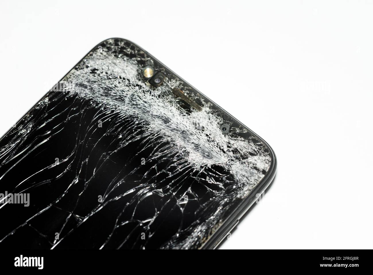 Mobile phone with broken screen on white background.Closeup Stock Photo ...