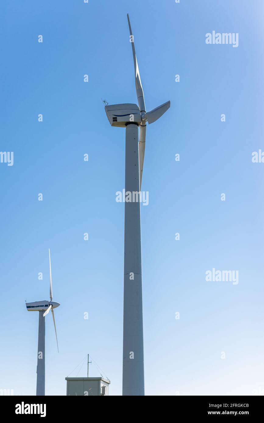 Wind power,Two wind turbines and blue sky.wind power concept with copy ...