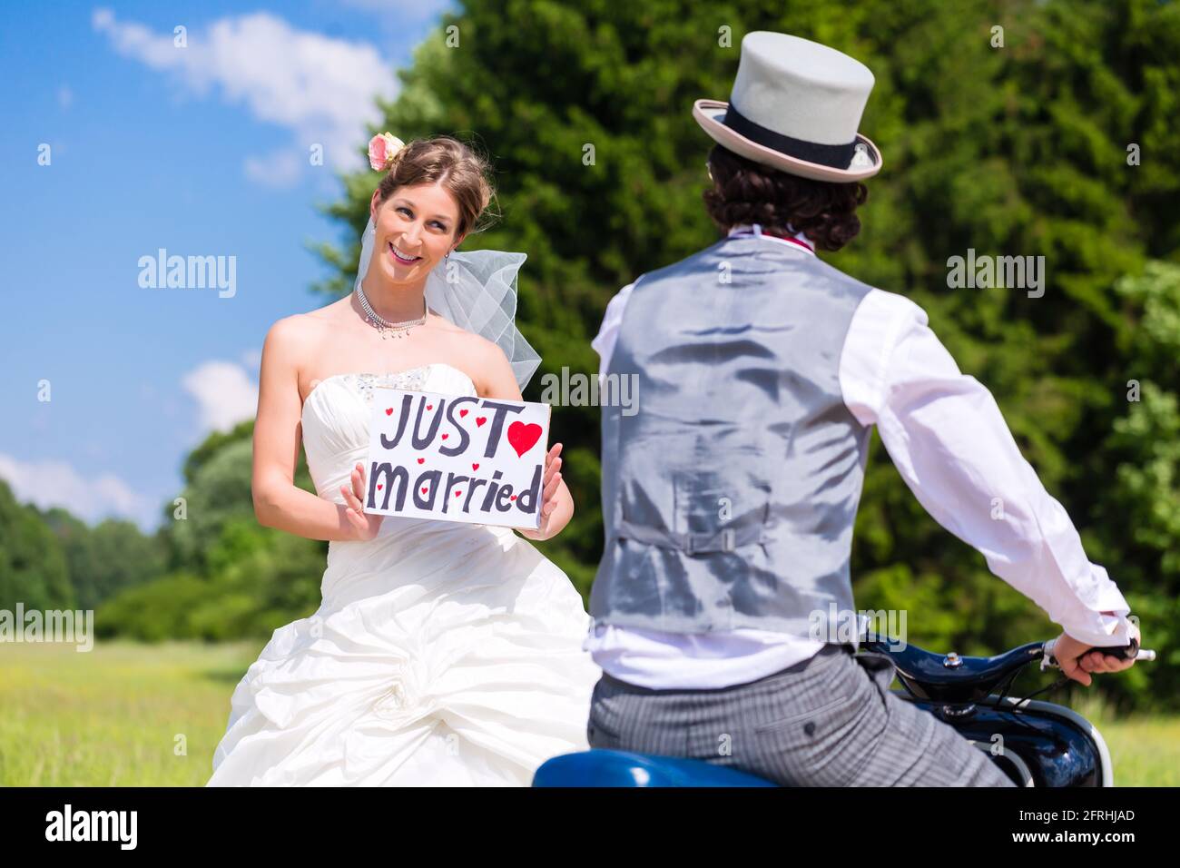 Wedding groom pick up bride with motor scooter having fun Stock Photo ...