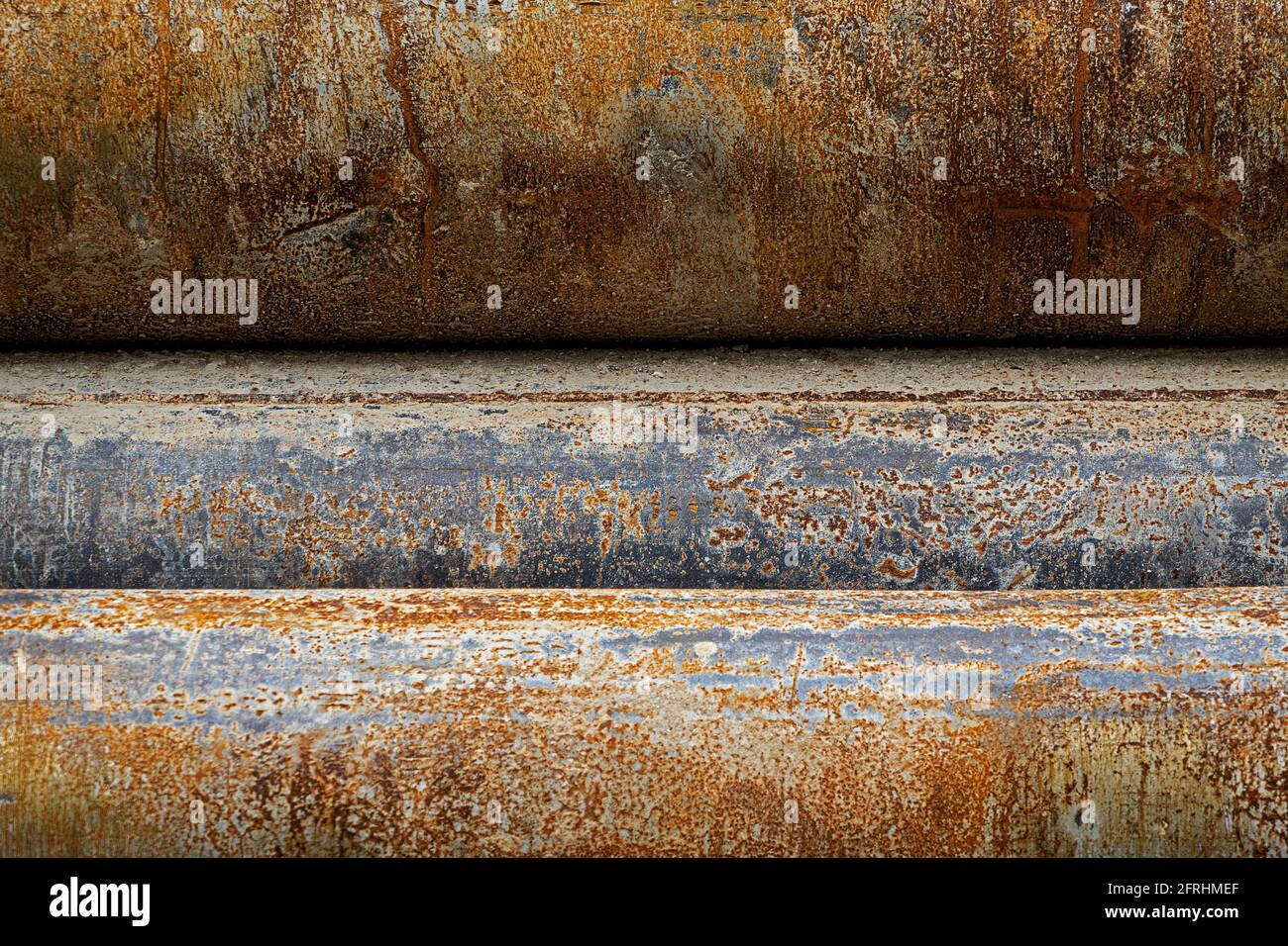 close up of a texture of steel pipes, gray, steel gray and rust colored ...